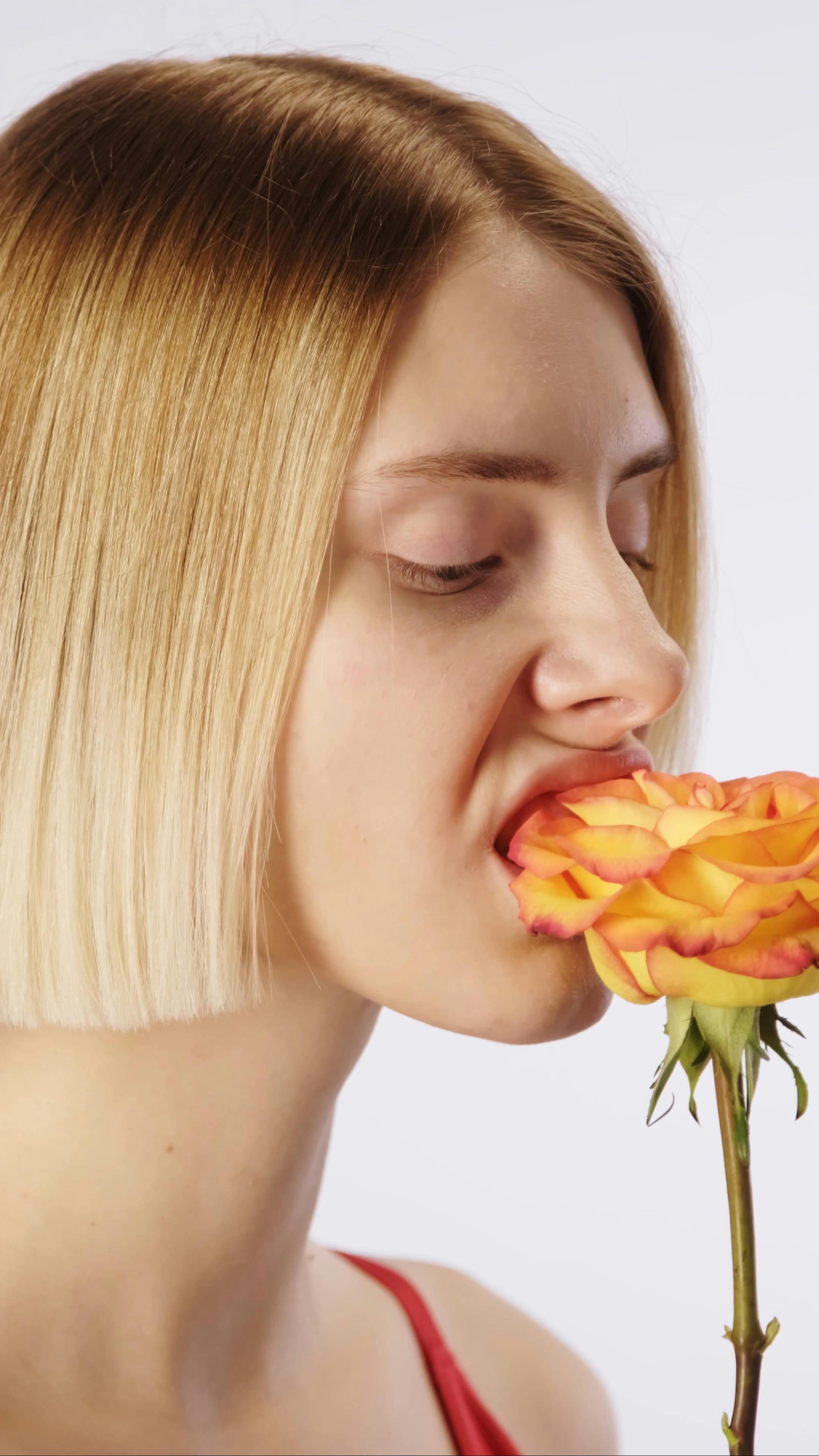 A Woman Biting the Petal of a Flower Free Stock Video Footage, Royalty ...