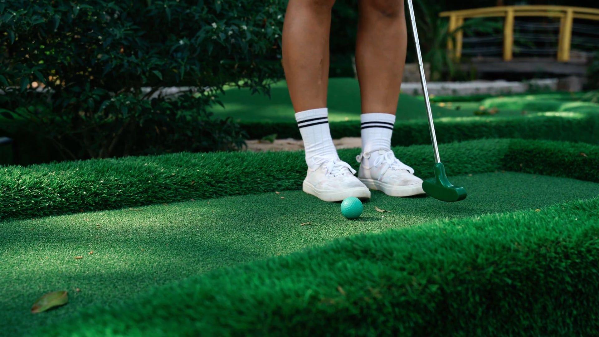 A Man Putting with his Sons on a Golf Course · Free Stock Video