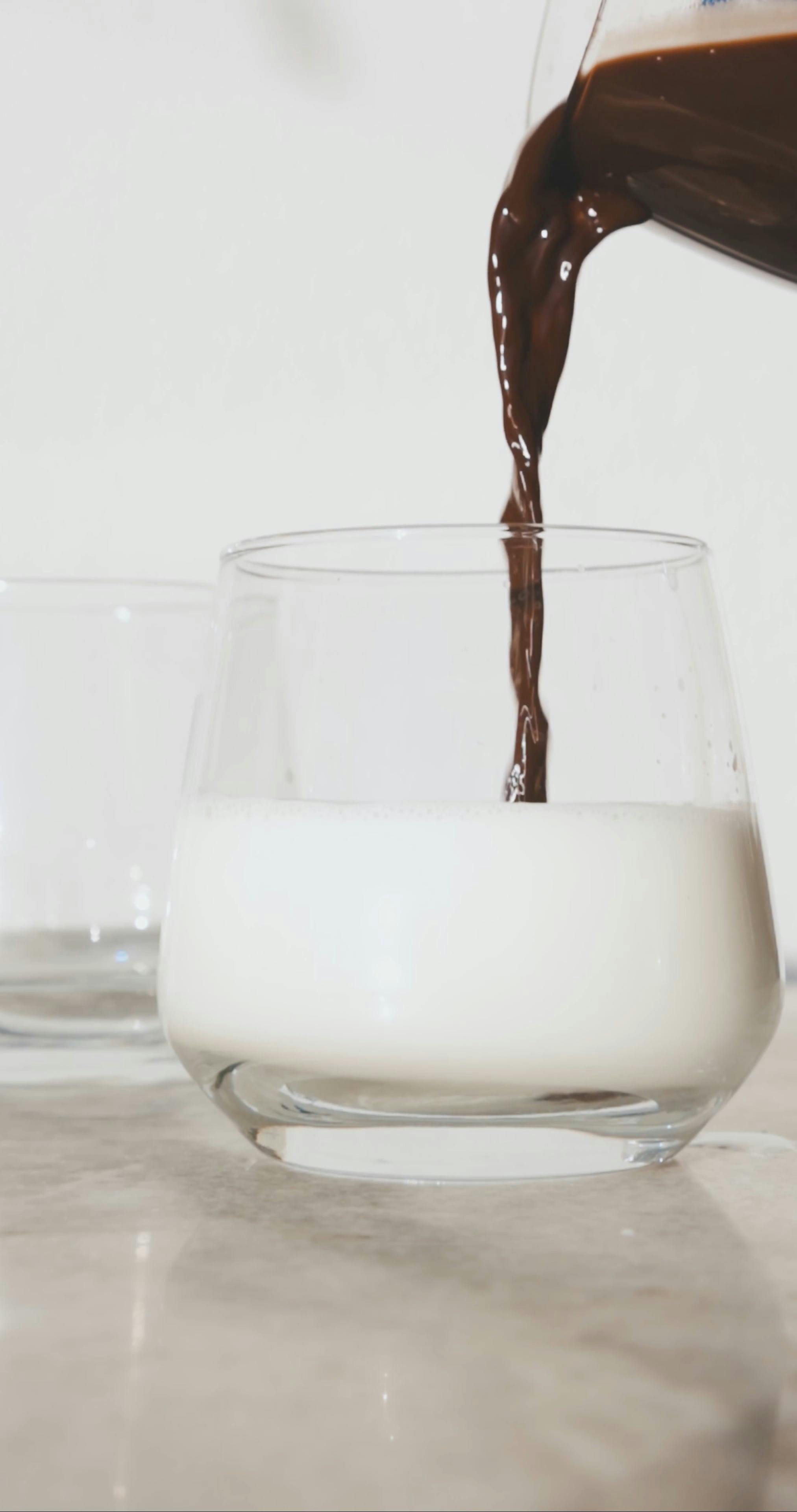 Pouring Chocolate Drink in Milk · Free Stock Video