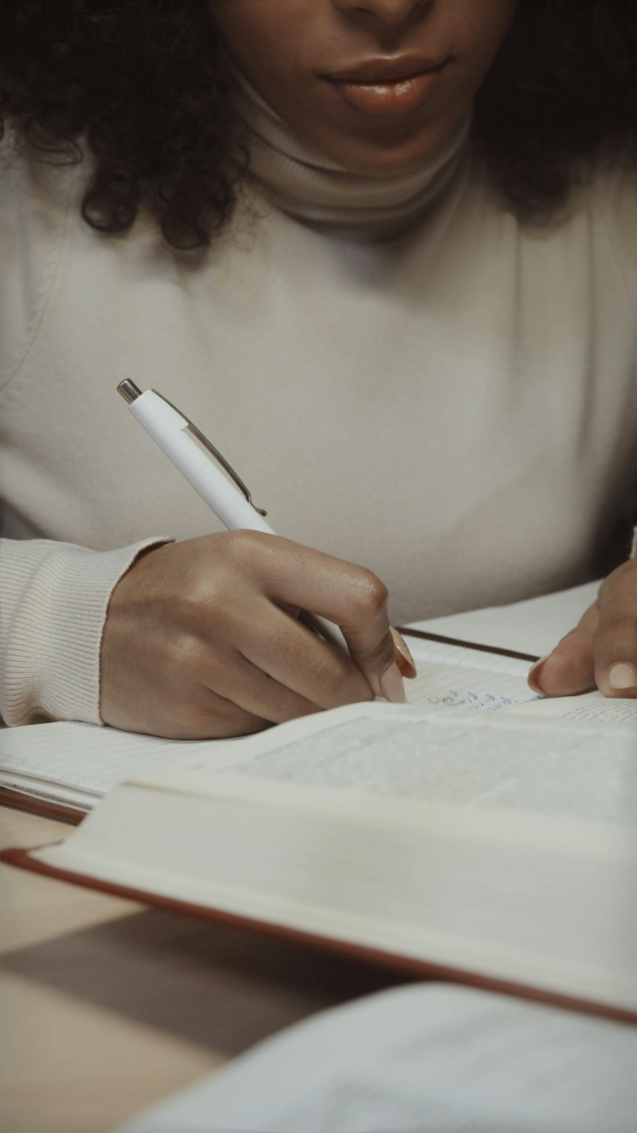 Man Taking Notes From A Book · Free Stock Video