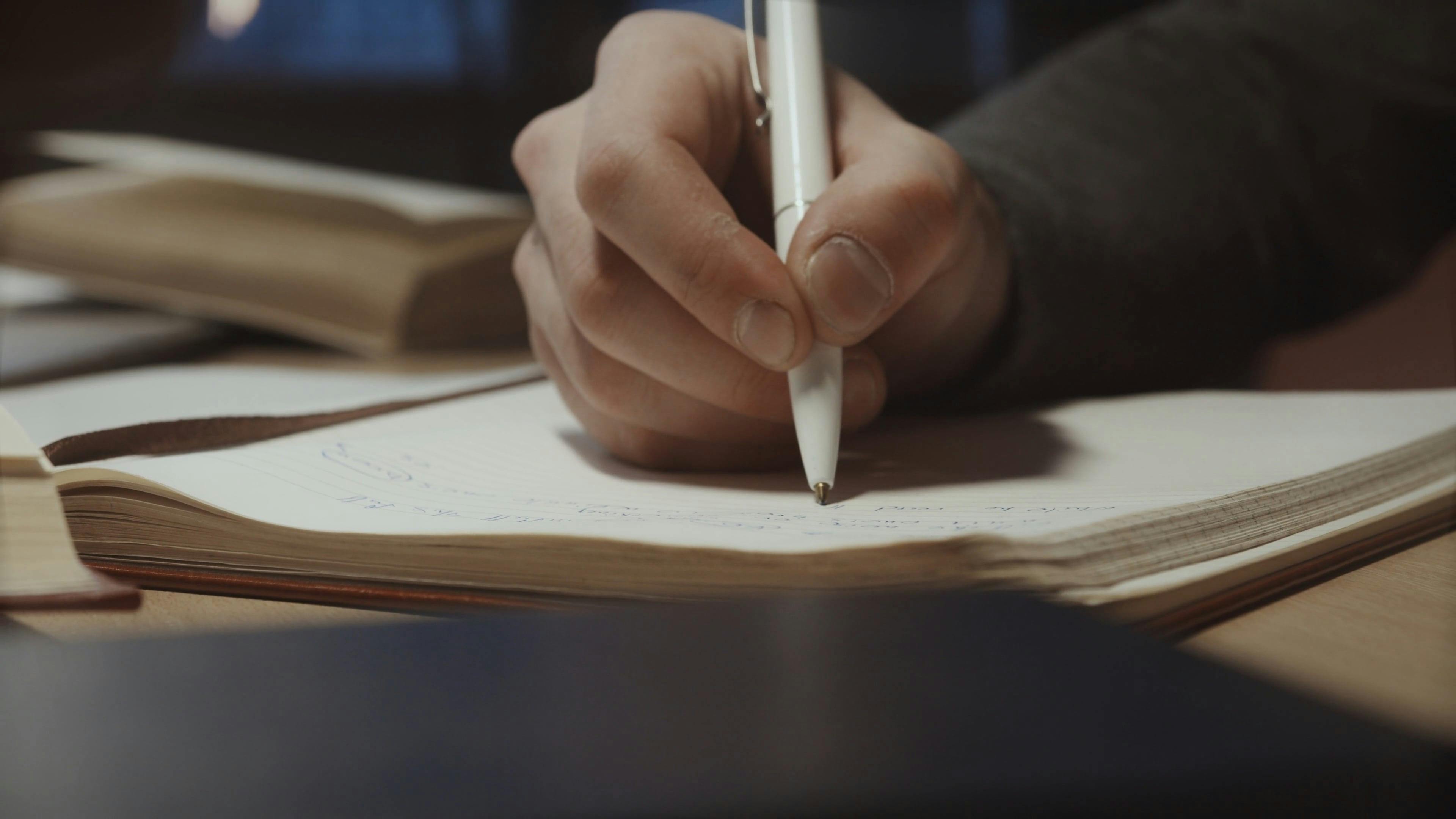 Man Writing Down In A Notebook Free Stock Video Footage, Royalty-Free ...