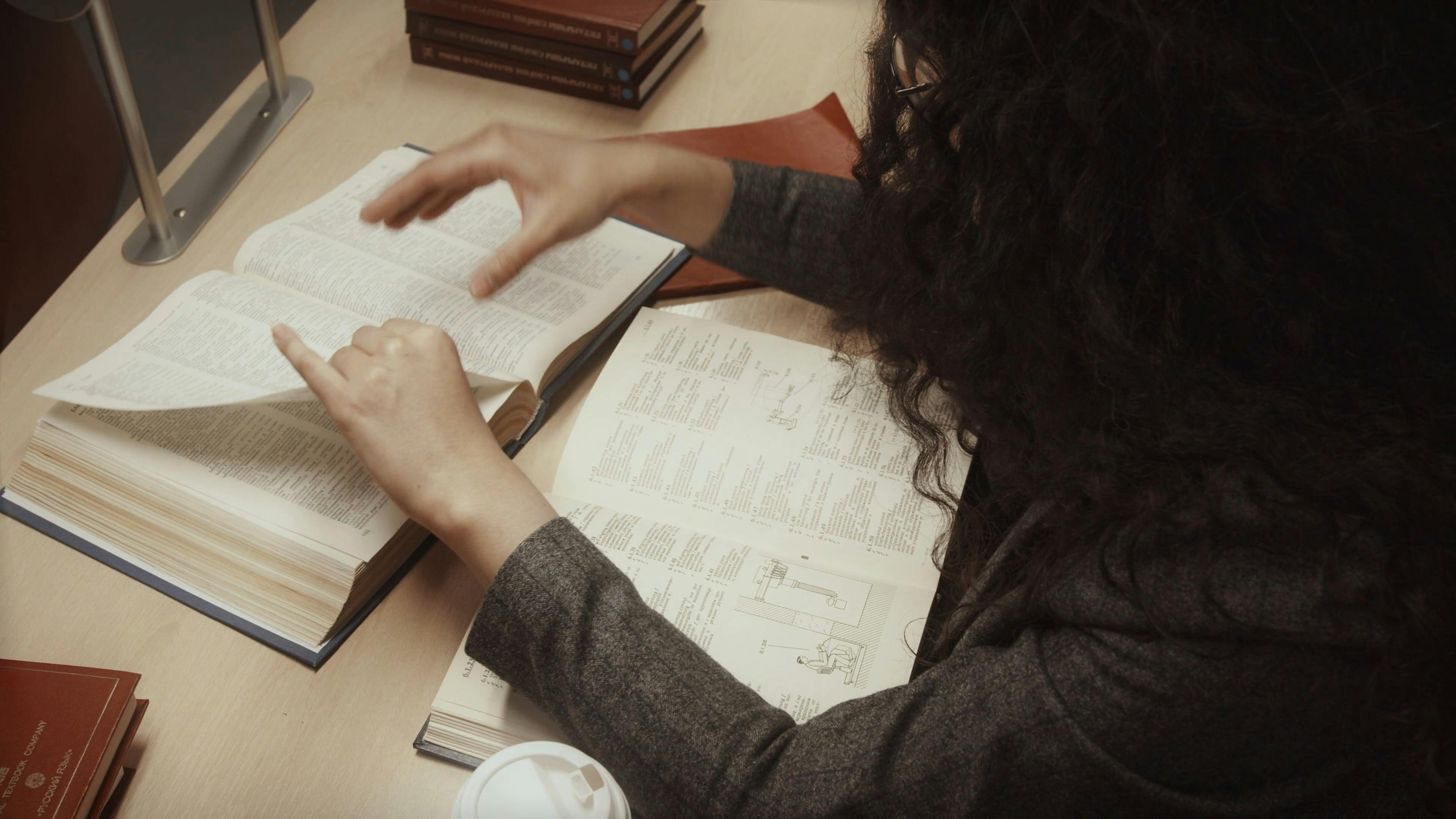 Woman Searching in a Book · Free Stock Video