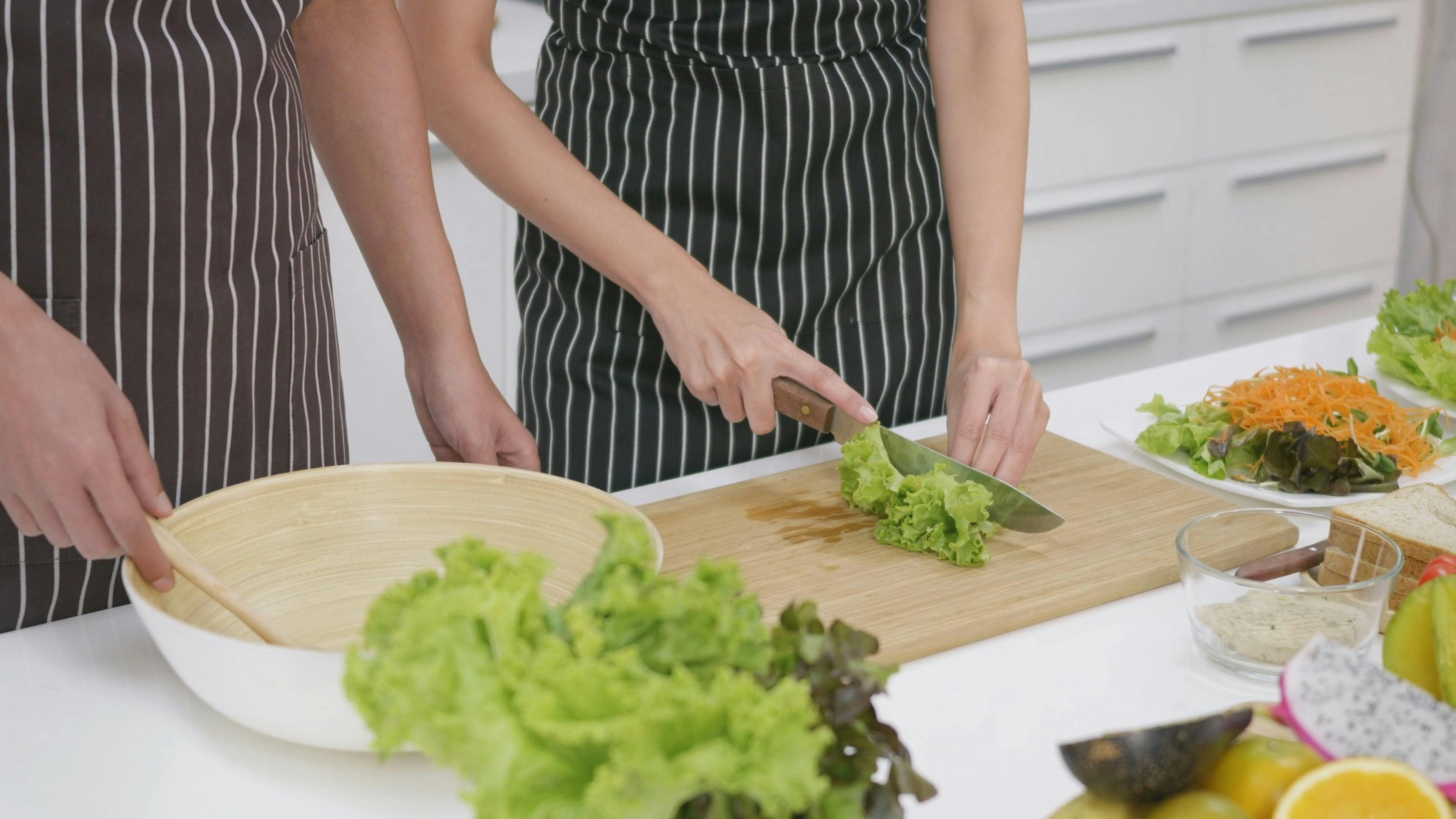 A Person Tossing A Vegetable Salad In A Bowl · Free Stock Video
