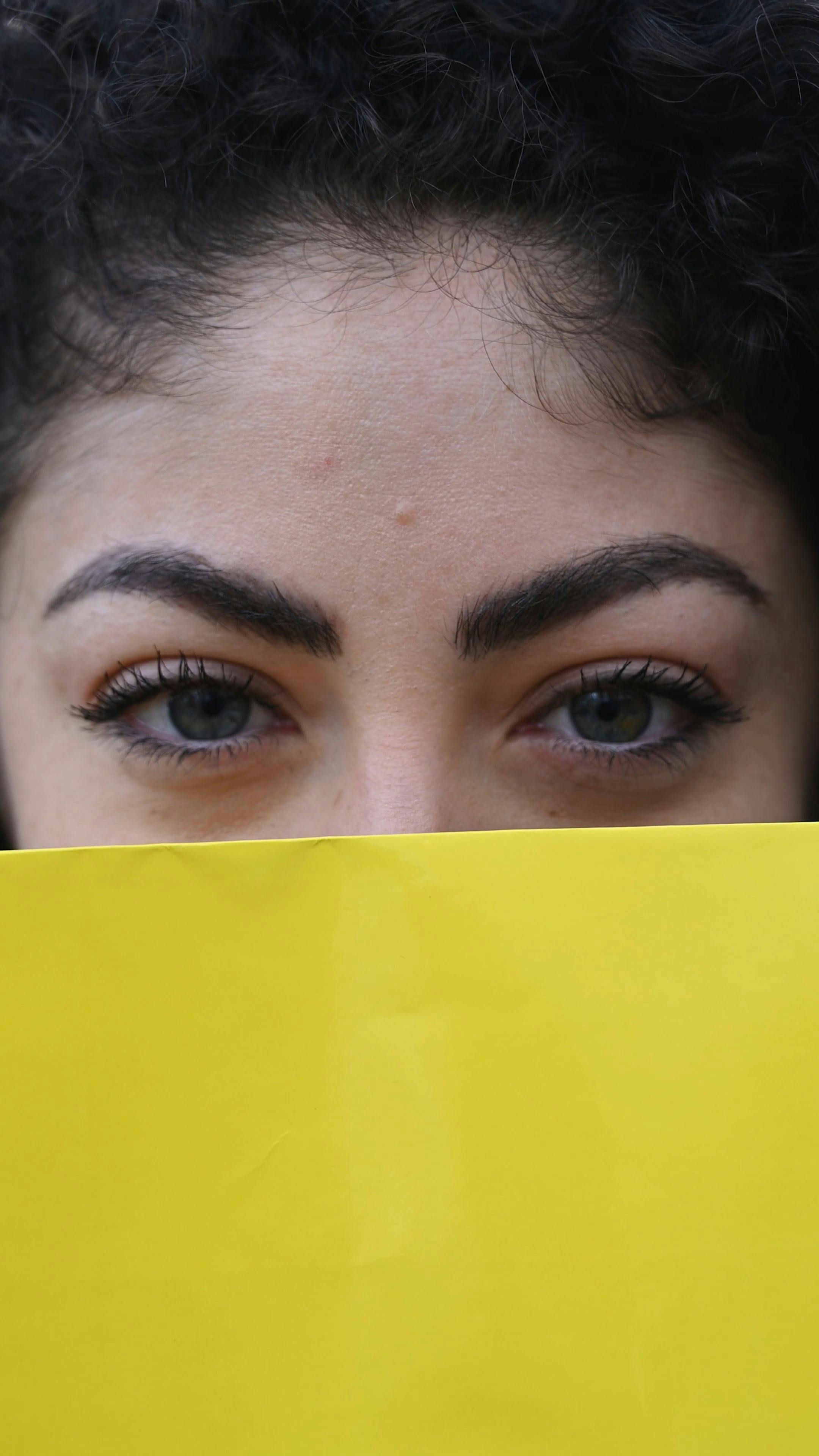 A Woman Blinking Her Eyes While Looking at the Camera Free Stock Video ...