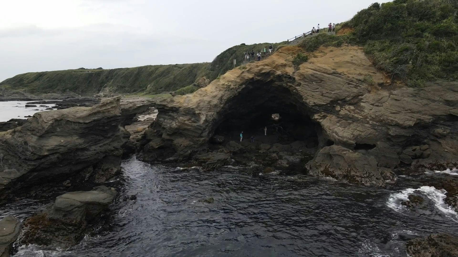 Drone Shot of People in a Cliffside Cave Free Stock Video Footage ...