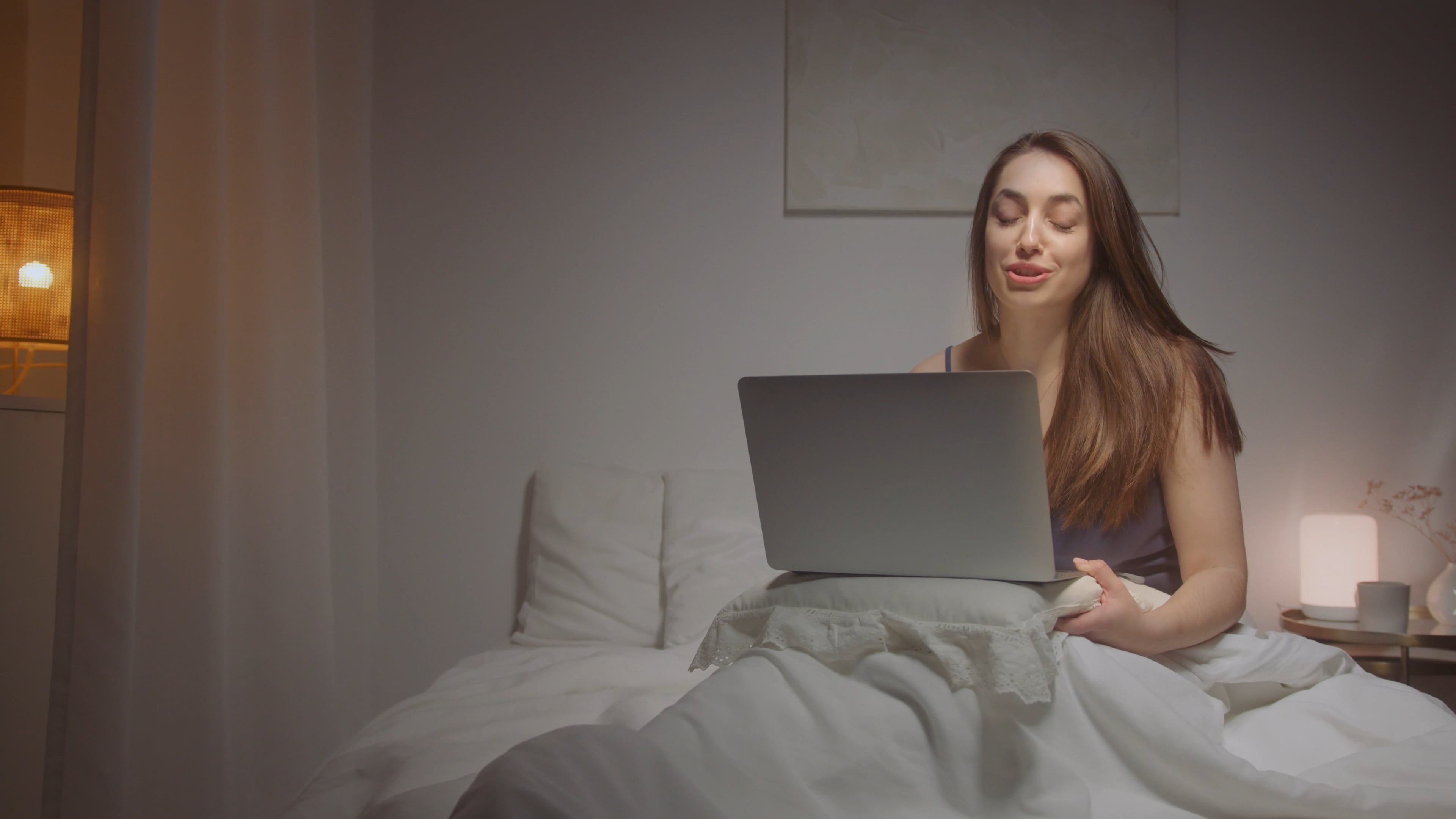 Woman on Video Call While in Bed · Free Stock Video