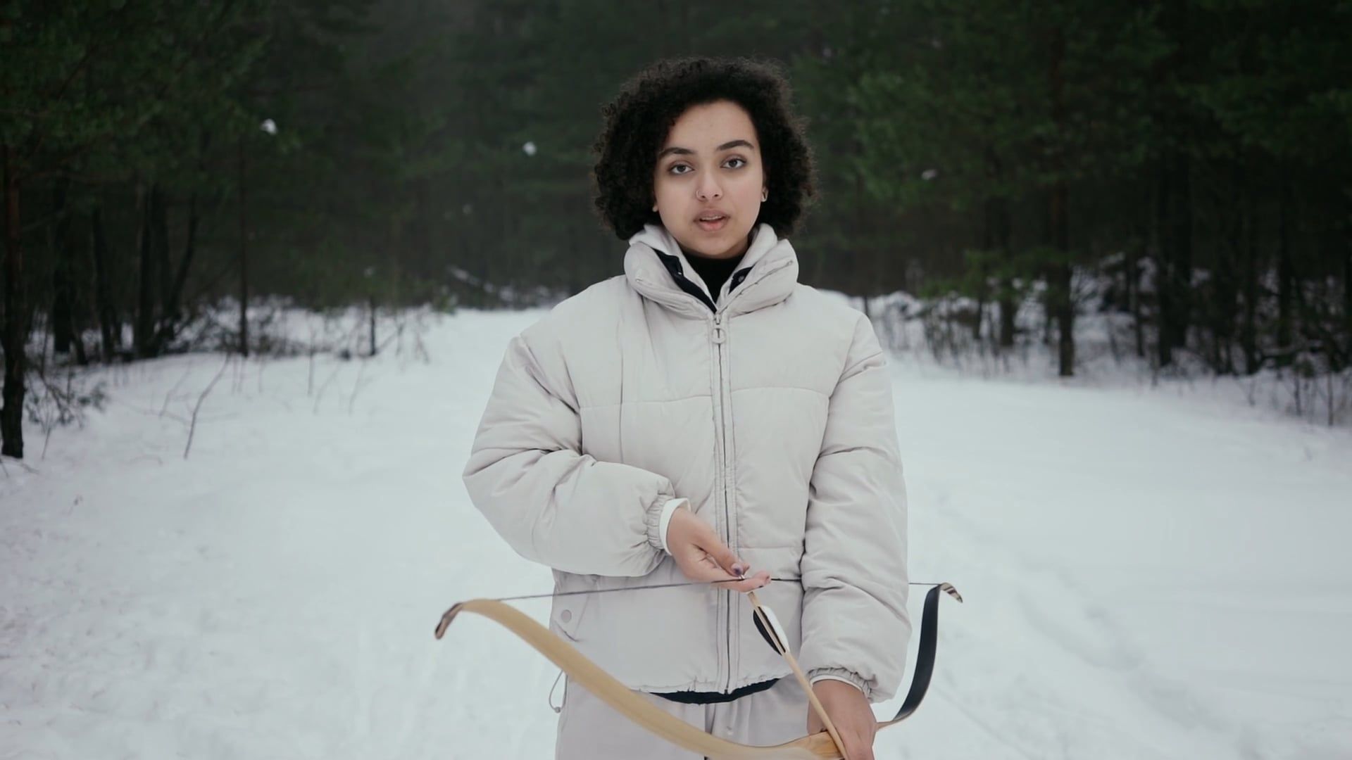 Woman Looking in the Camera while Holding a Bow and Arrow Free Stock ...
