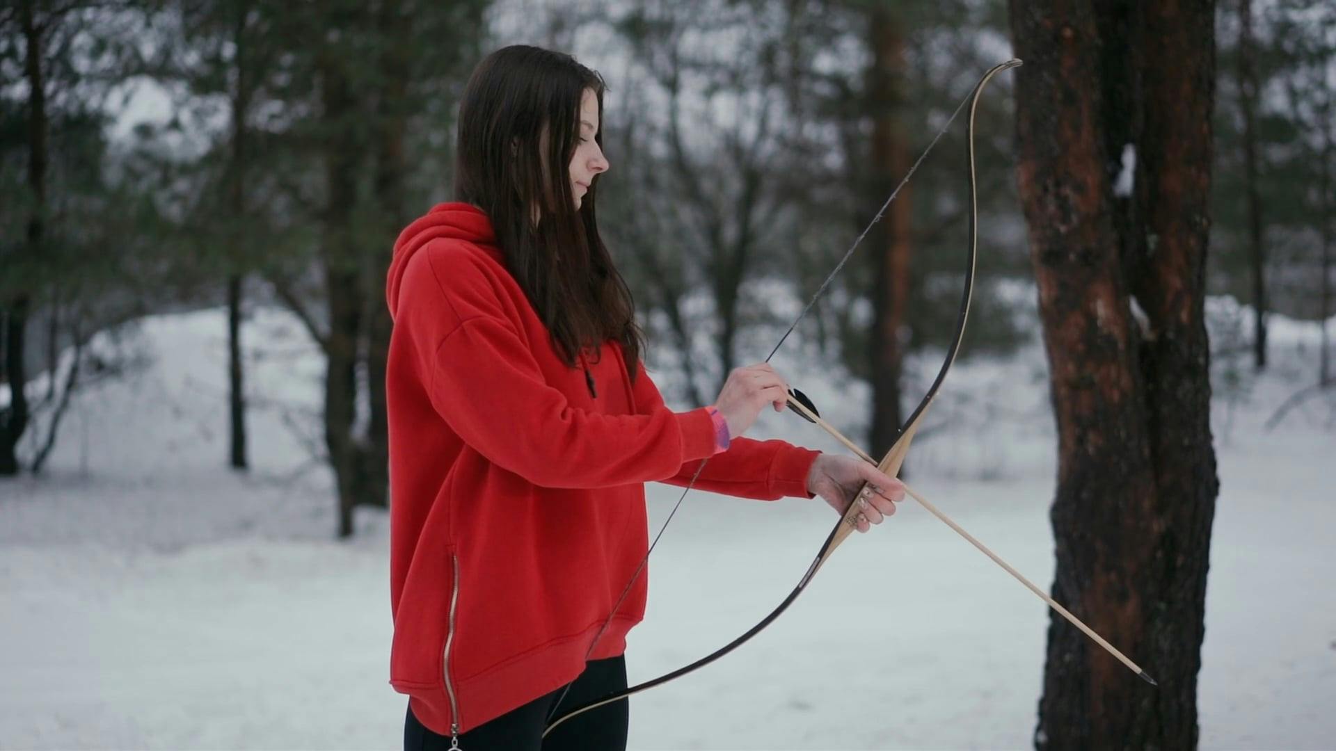 Woman Doing Archery in the Snow · Free Stock Video