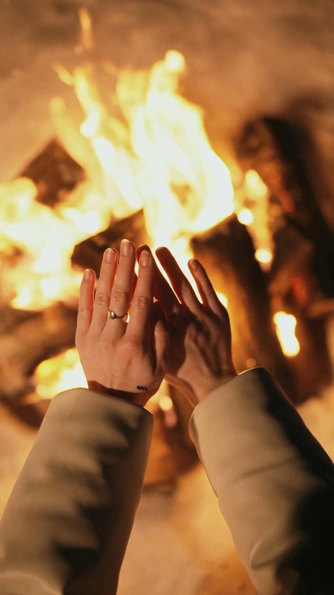 Hands Getting Warm in a Bonfire · Free Stock Video