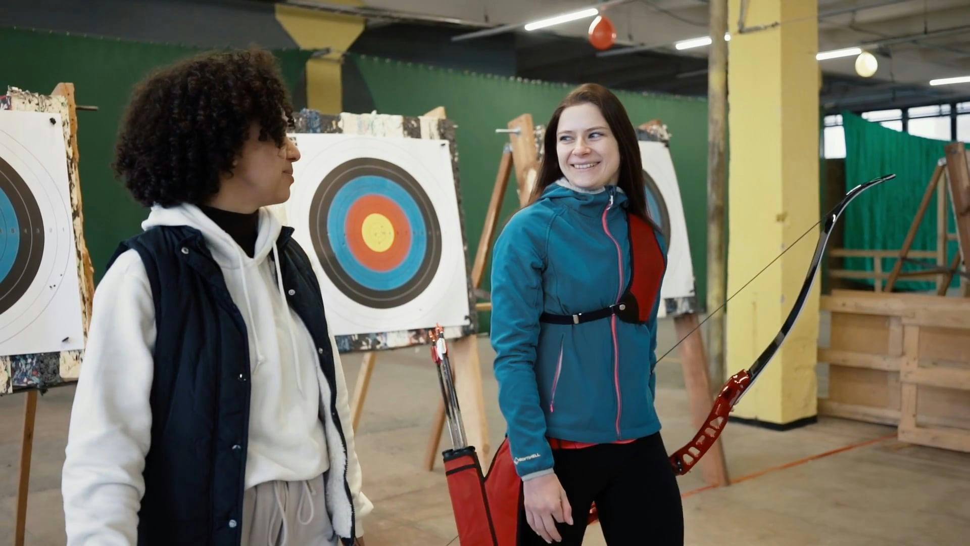 Two Women Holding Bow and Arrow · Free Stock Video