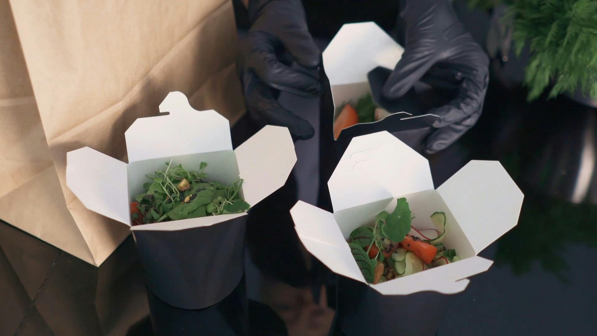 A Person Closing the Cover of the Packed Food · Free Stock Video