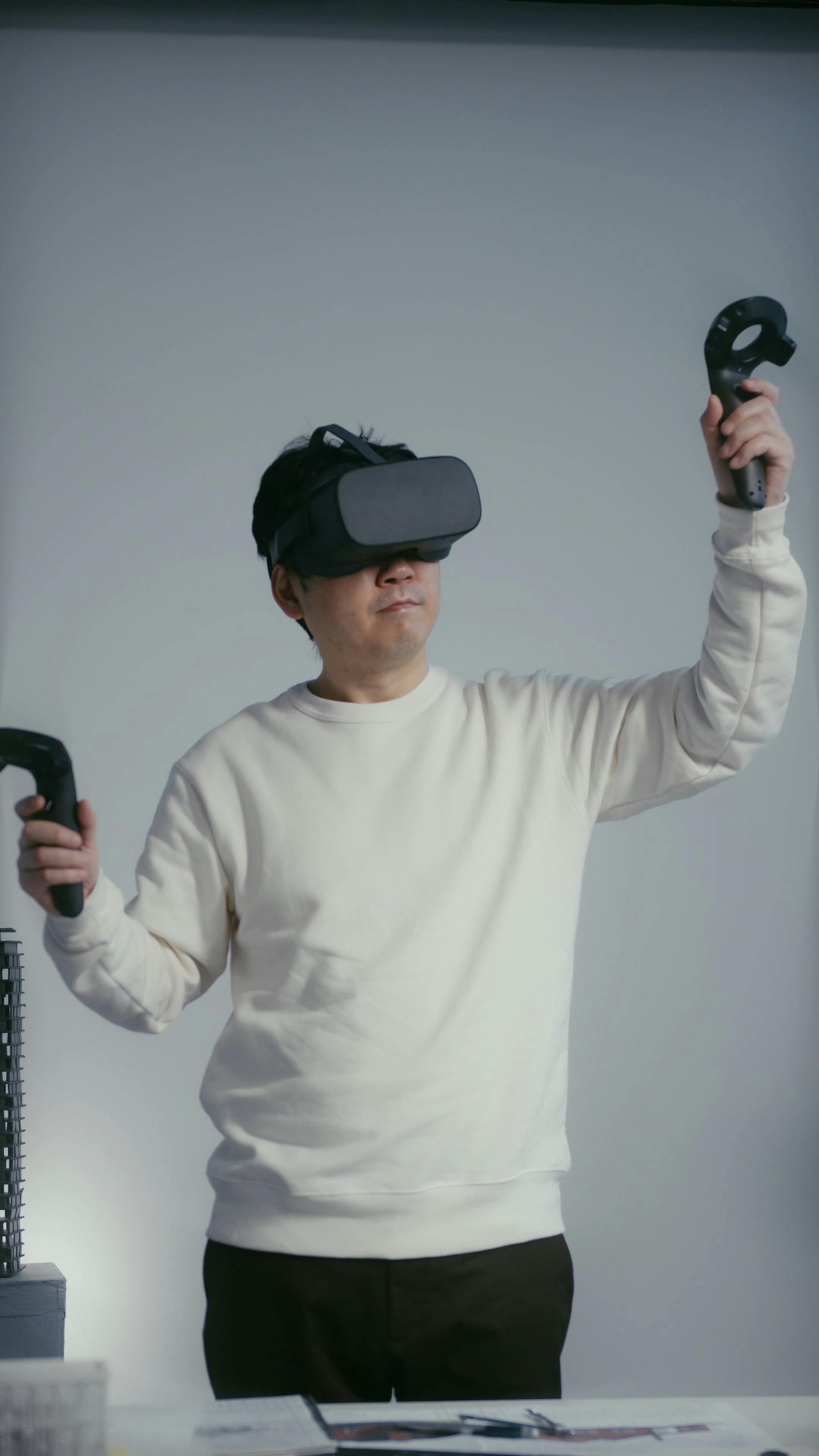 Man Using VR Headset and Controllers · Free Stock Video