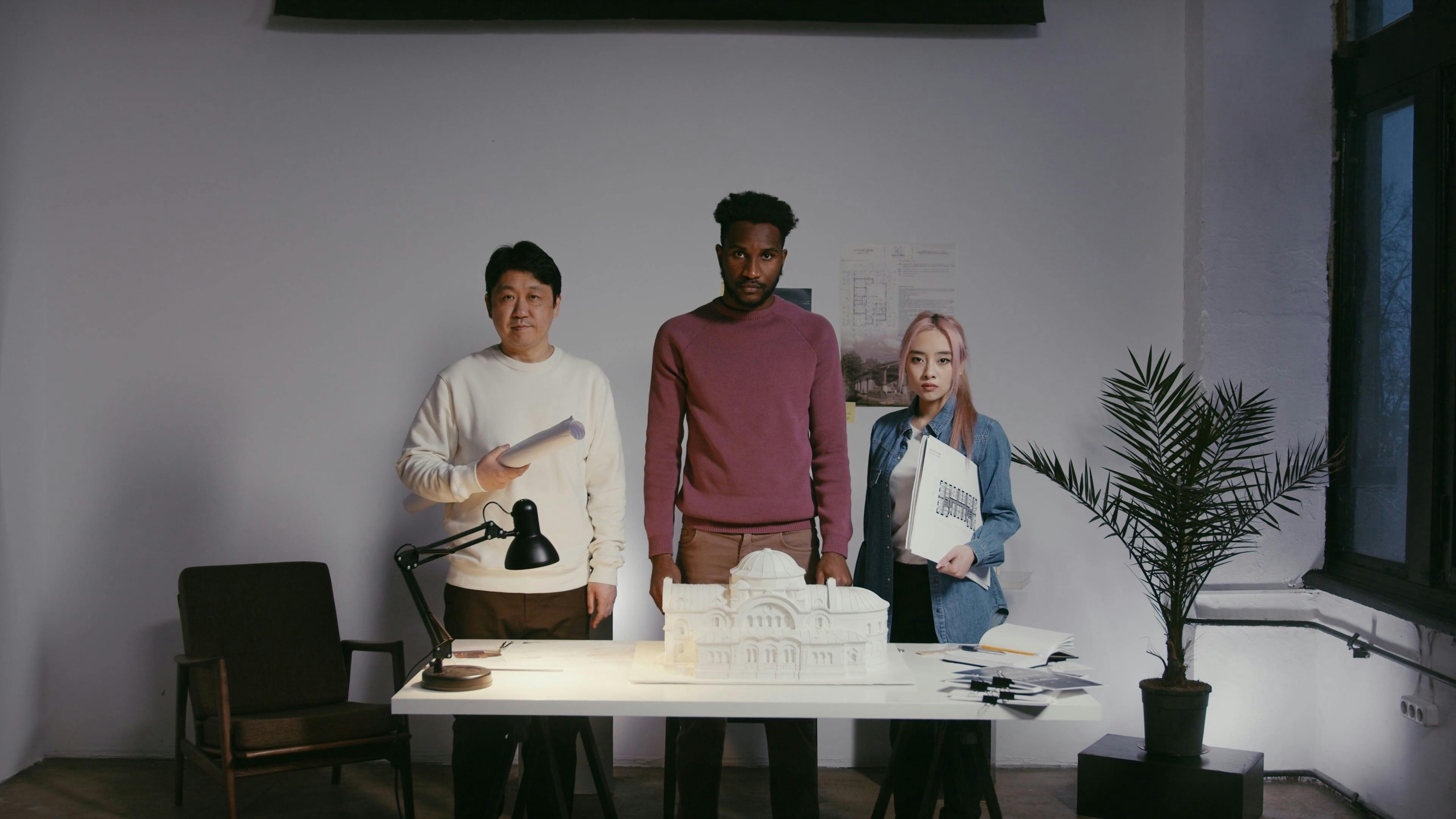 People Posing Behind Scale Model of Building · Free Stock Video