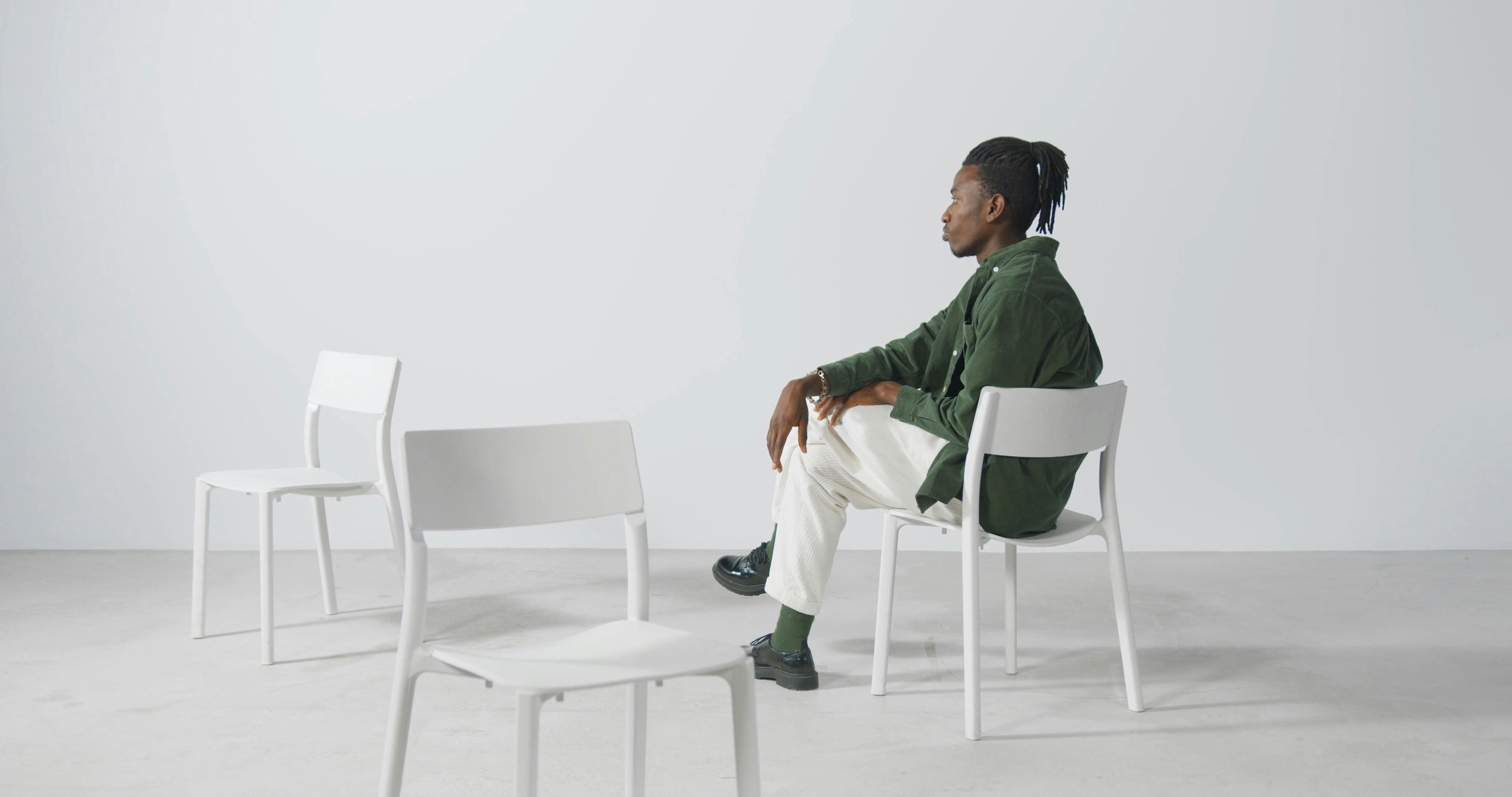 A Man Sitting on a Chair · Free Stock Video