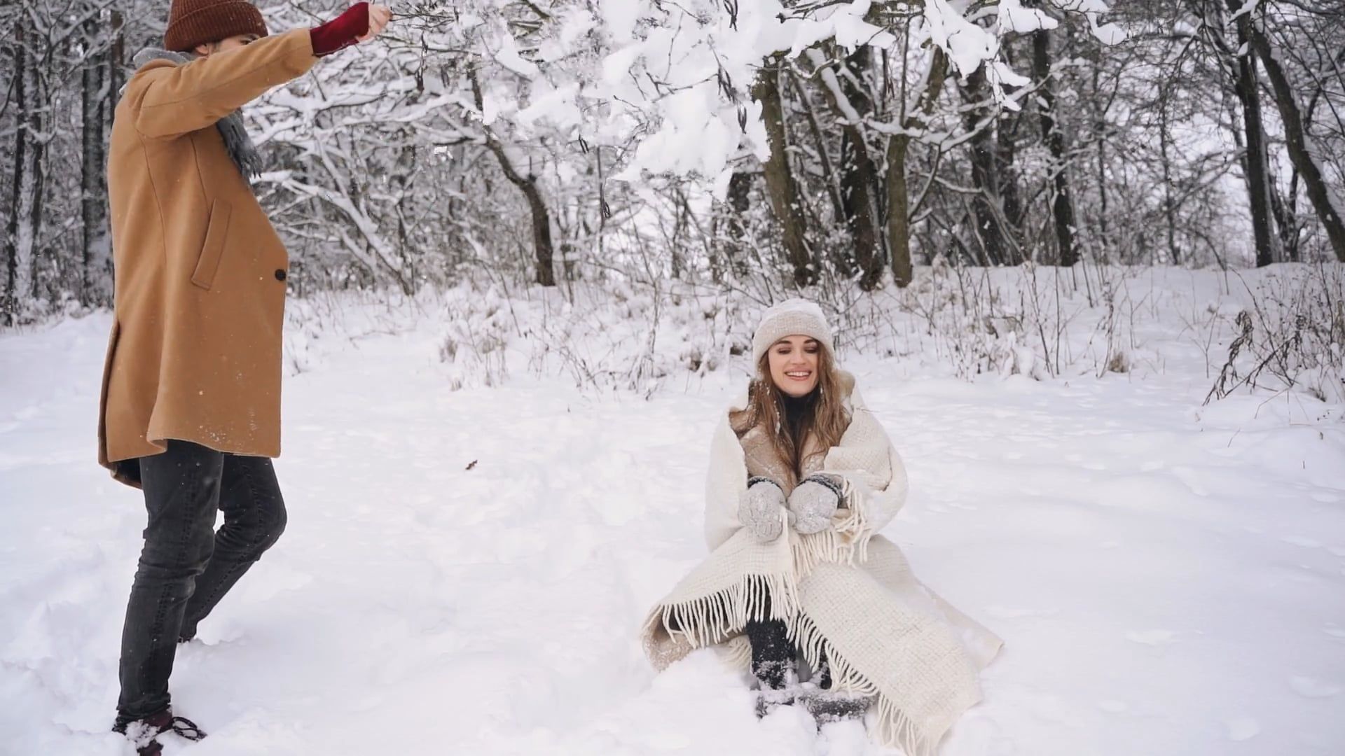 Man Shaking a Tree Branch Covered with Snow Free Stock Video Footage ...
