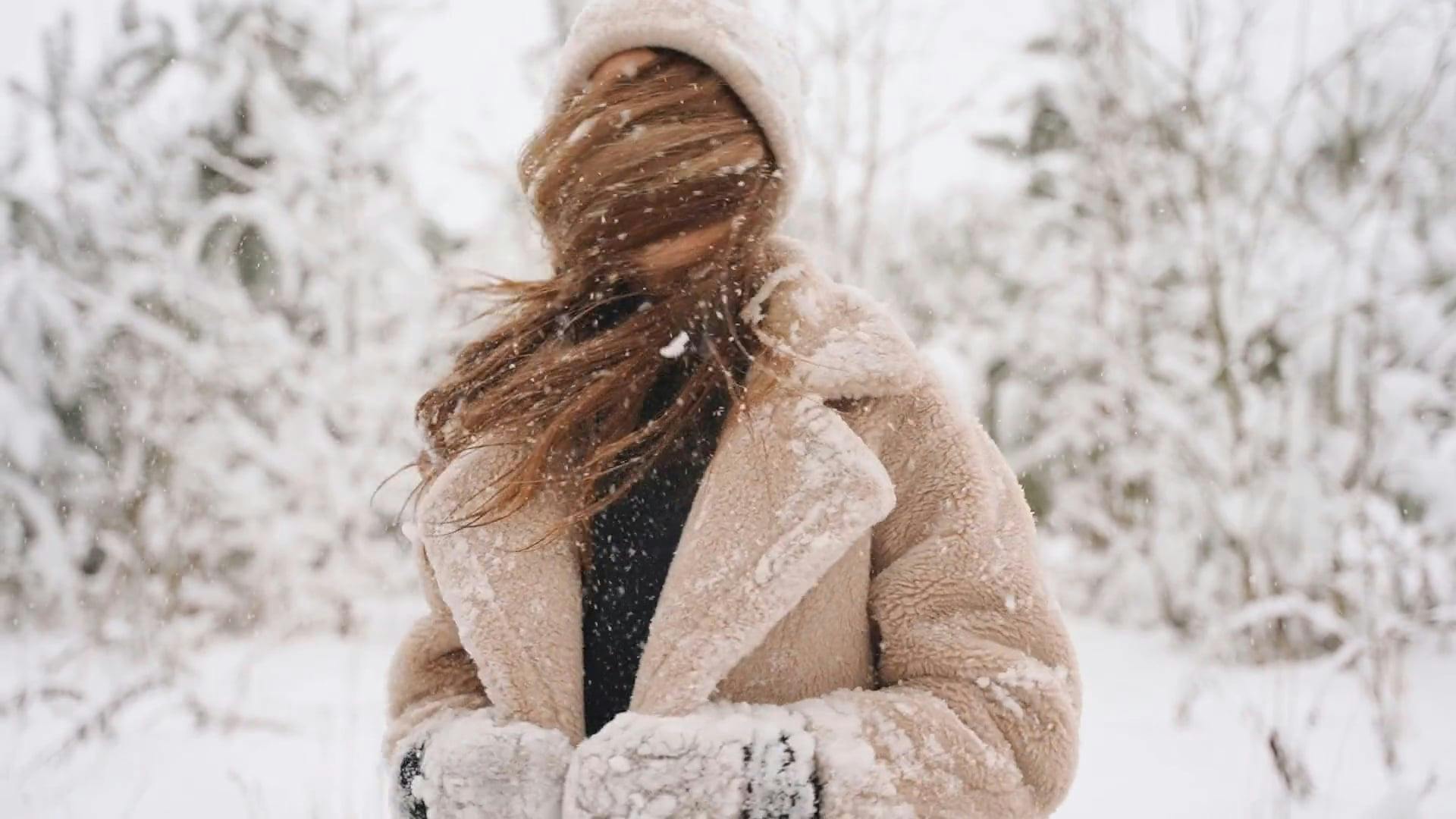 A Woman Removing Snow on her Hair · Free Stock Video