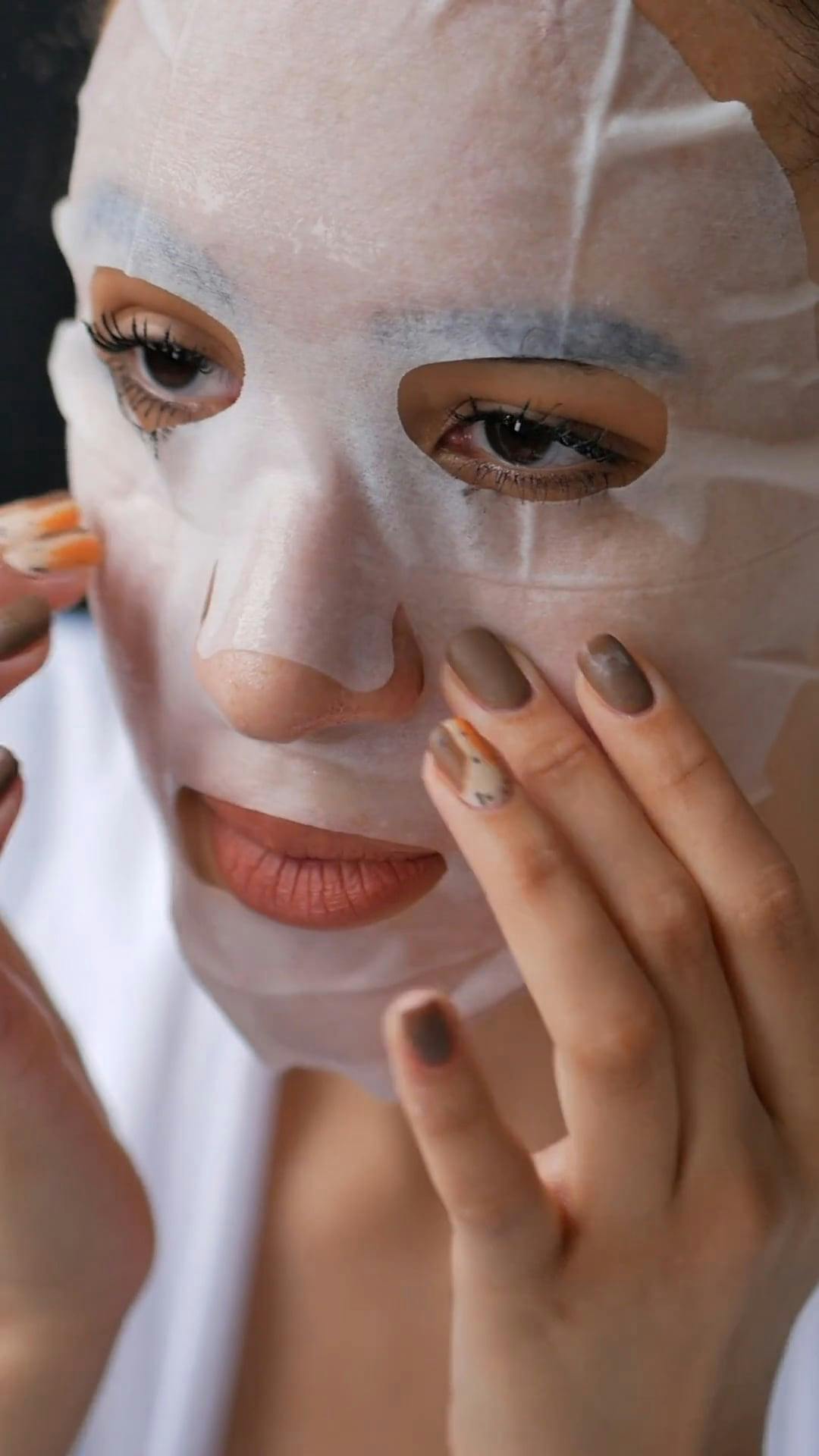 Woman Putting on a Cosmetic Face Mask Free Stock Video Footage, Royalty ...