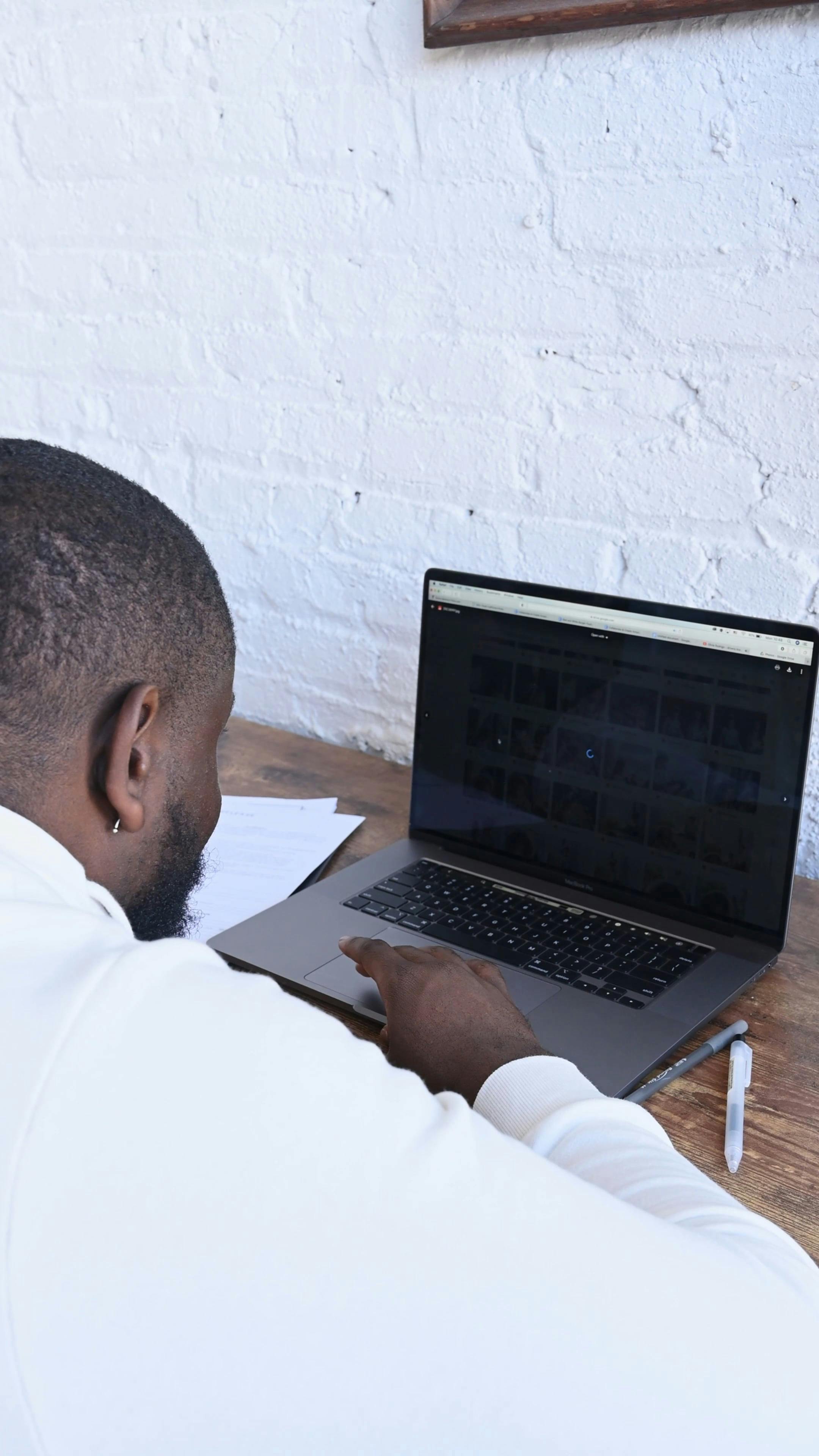 Man Viewing Pictures on Laptop Free Stock Video Footage, Royalty-Free ...