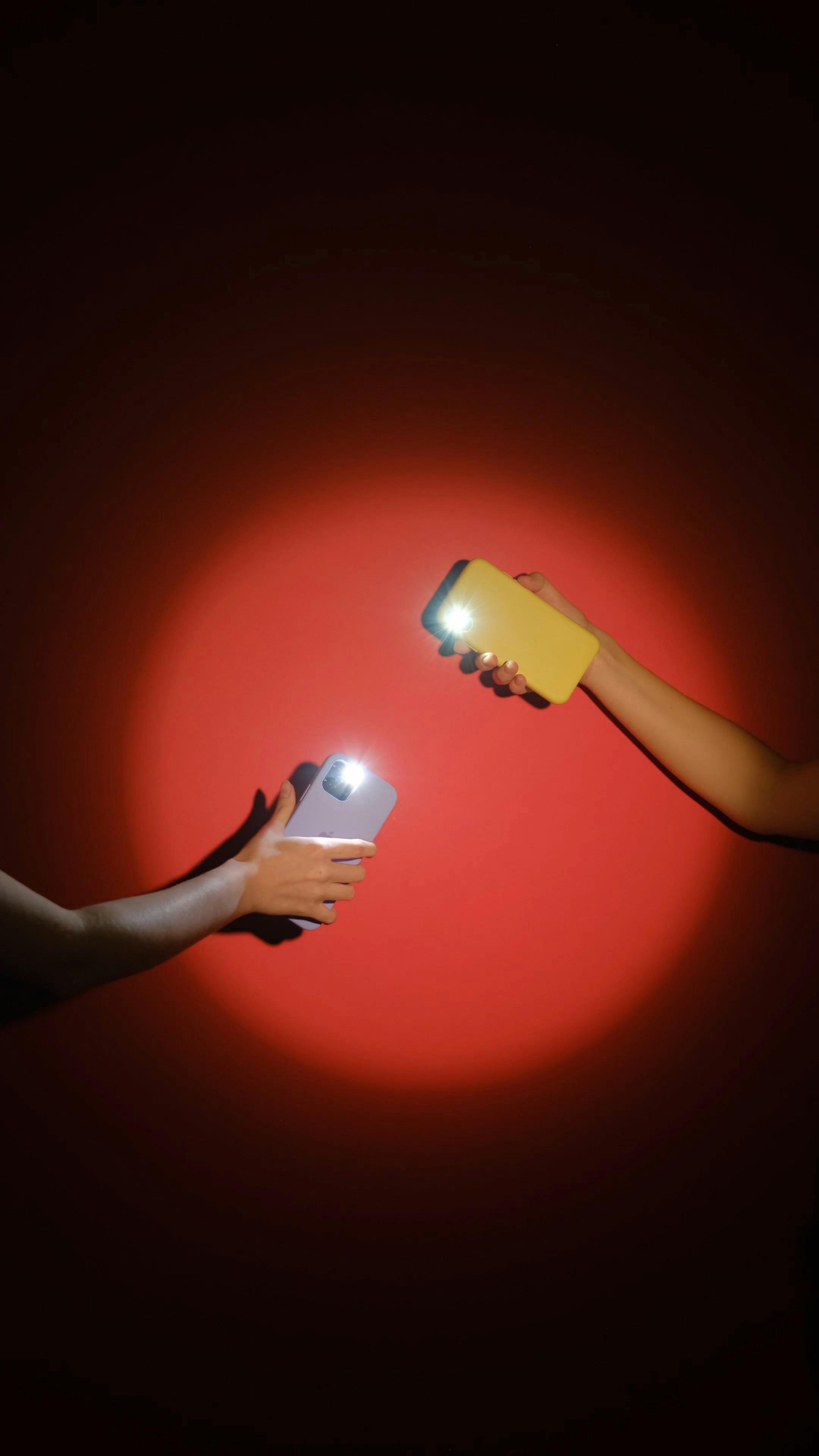 Phone Flashing While On The Spotlight · Free Stock Video