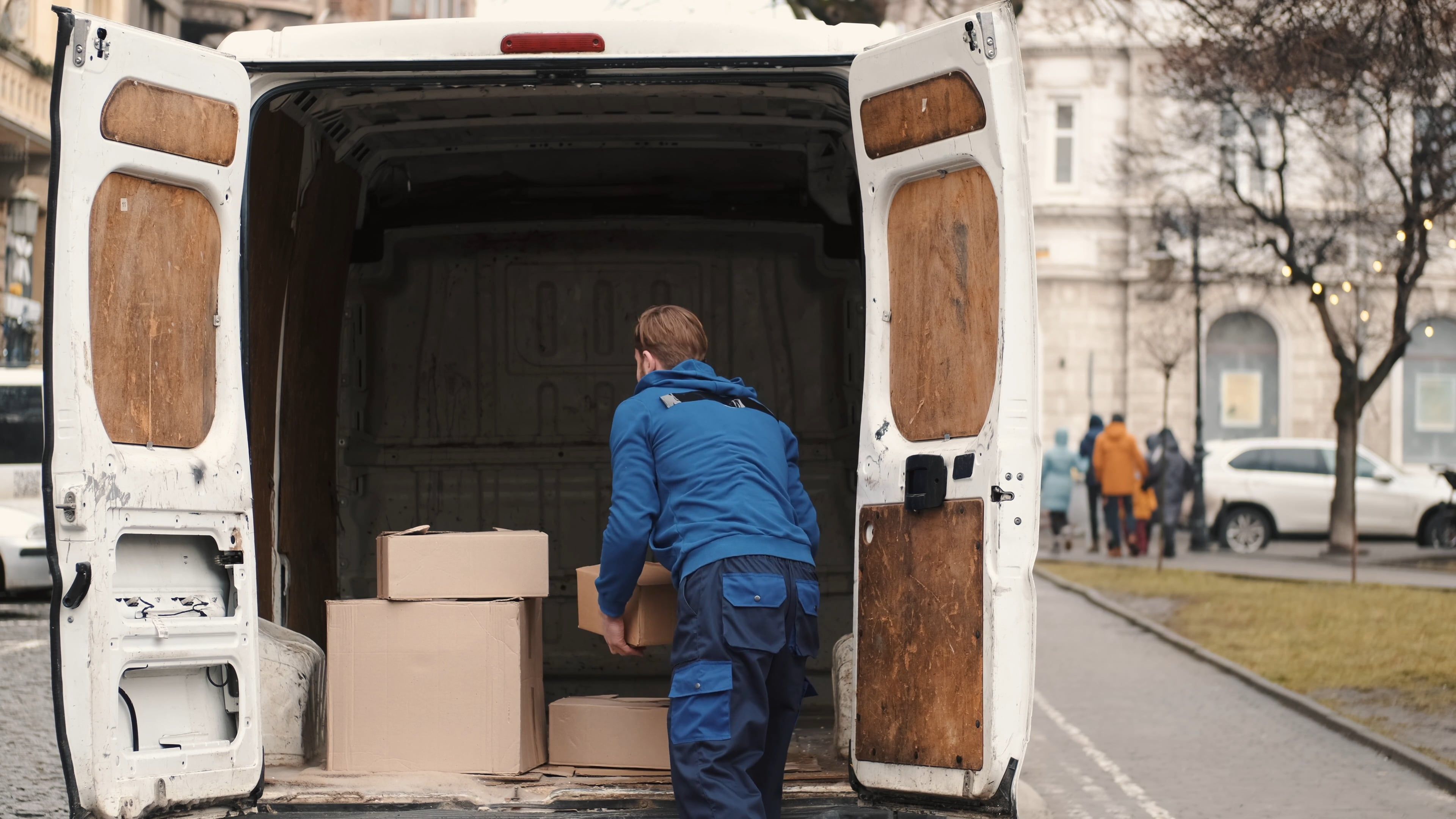 A Man Carrying a Box While Walking · Free Stock Video