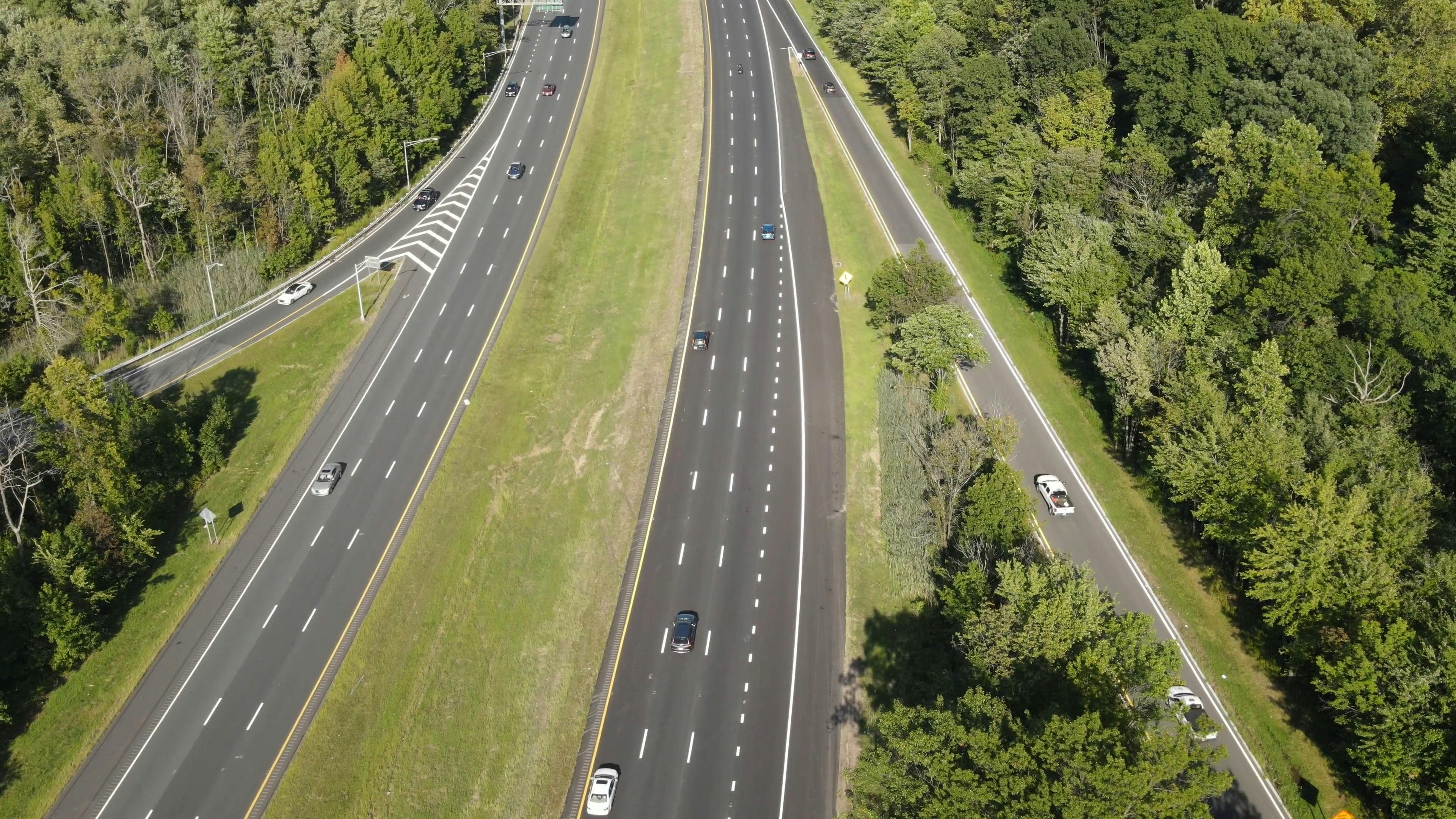 Drone Footage of an Highway Between the Forest · Free Stock Video