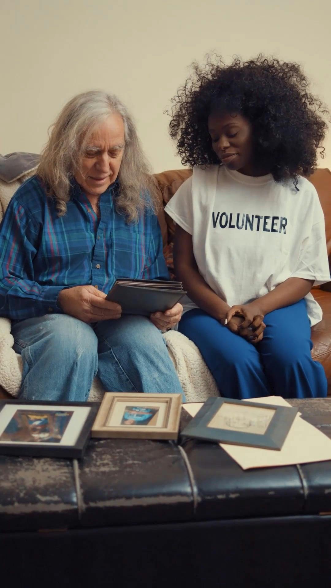 A Man Showing Pictures to a Woman · Free Stock Video