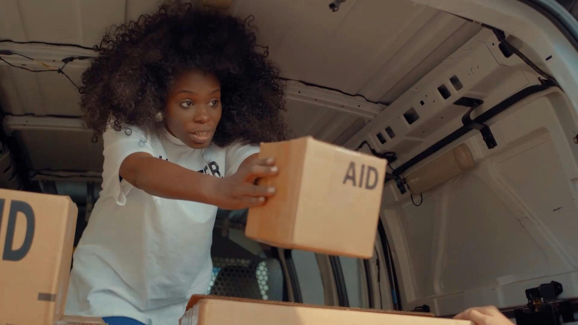 A Low Angle Shot of a Woman Giving Boxes Free Stock Video Footage ...
