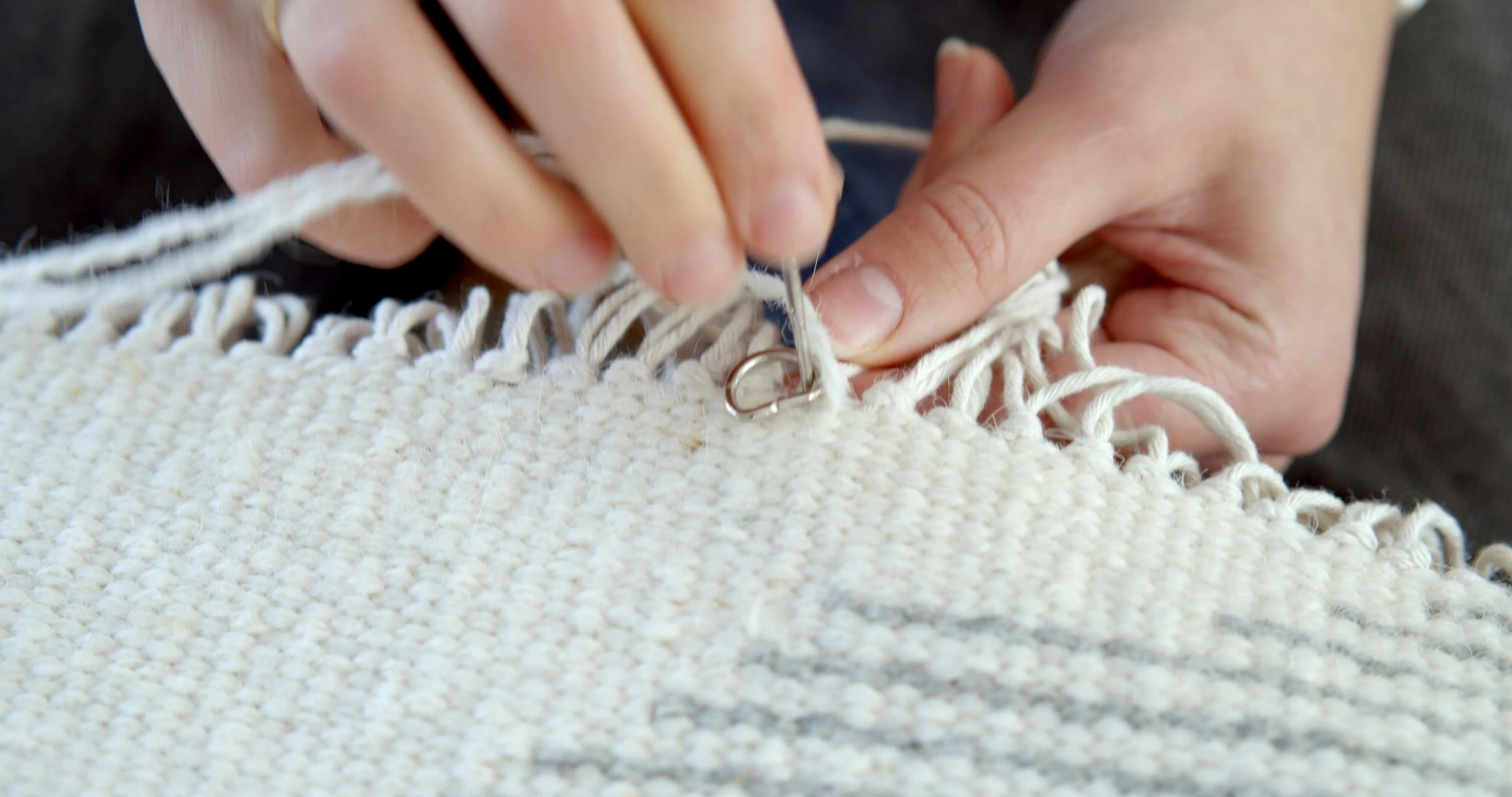 Person With Needle Pulling Thread · Free Stock Video