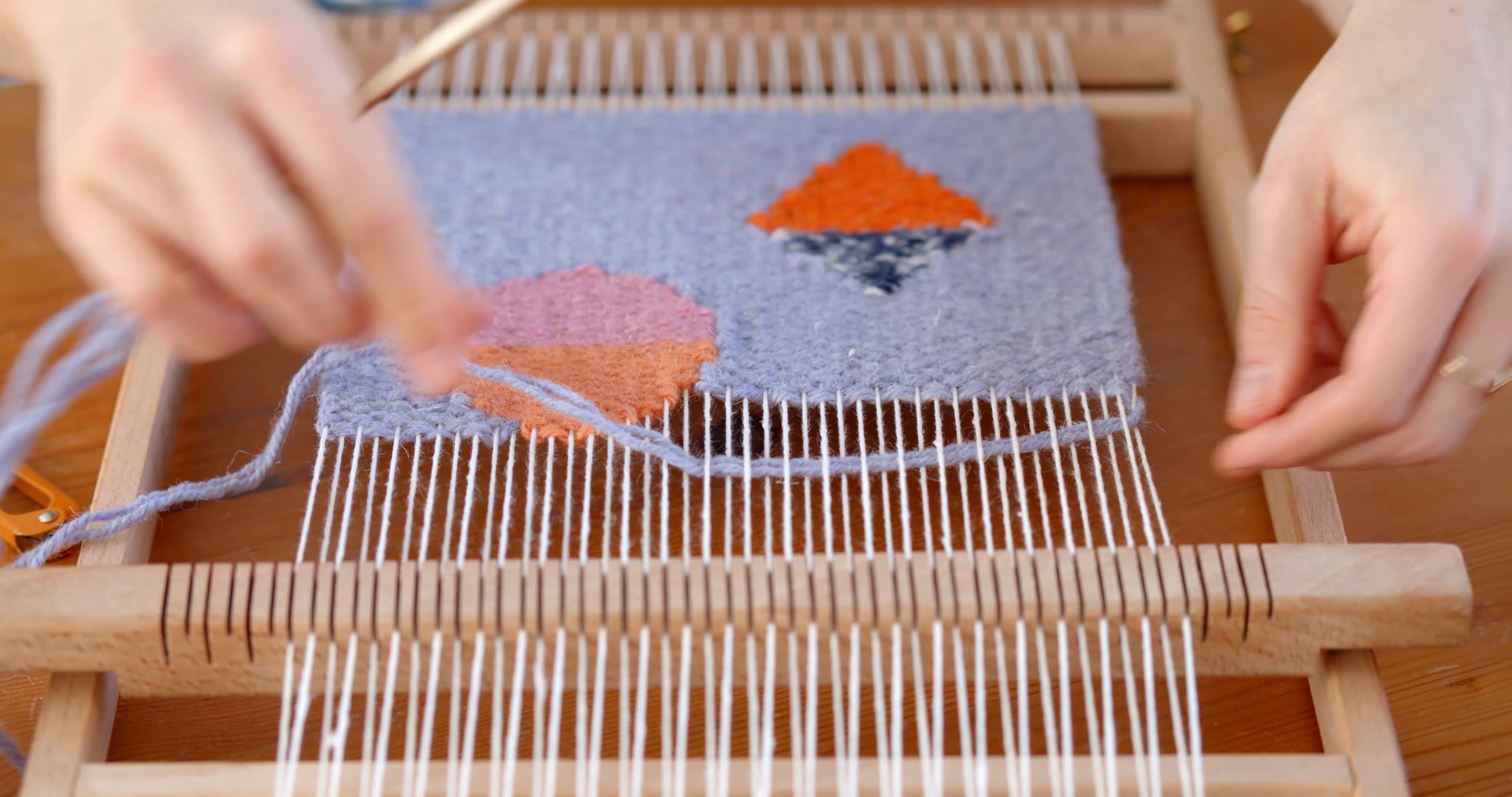 A Person Weaving Using a Hand Loom · Free Stock Video