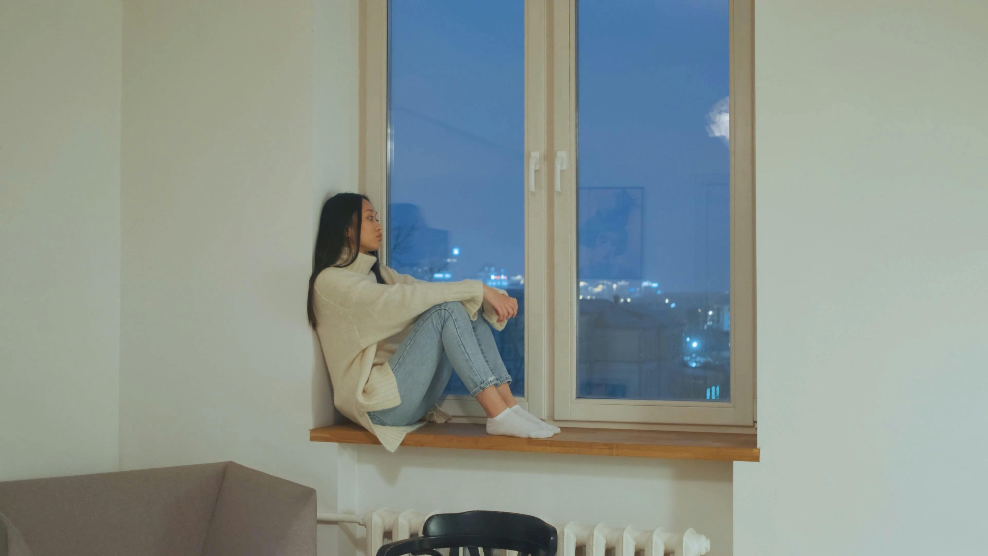 Sad Woman Looking Outside by the Window · Free Stock Video