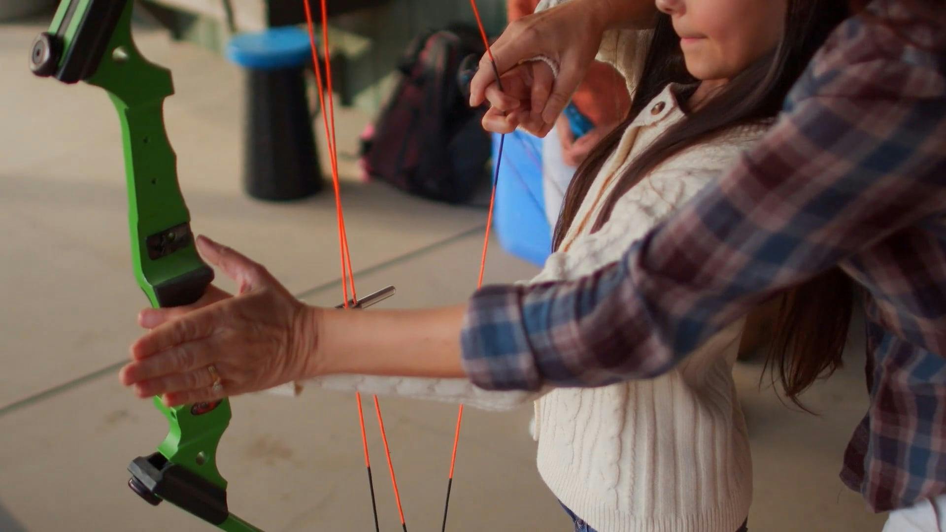 Woman Teaching Girl Archery · Free Stock Video