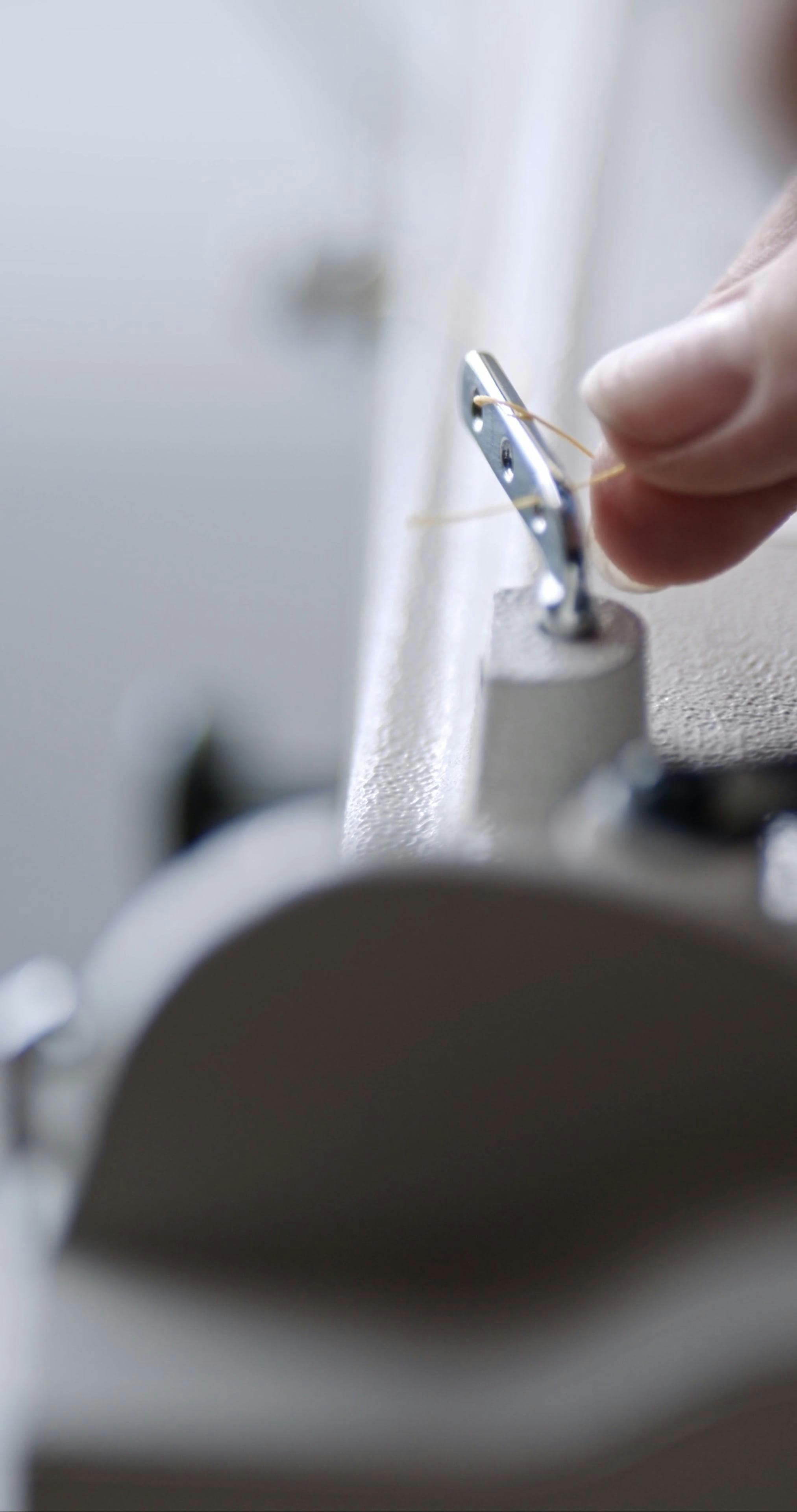 A Person Putting Thread on a Sewing Machine Free Stock Video Footage ...