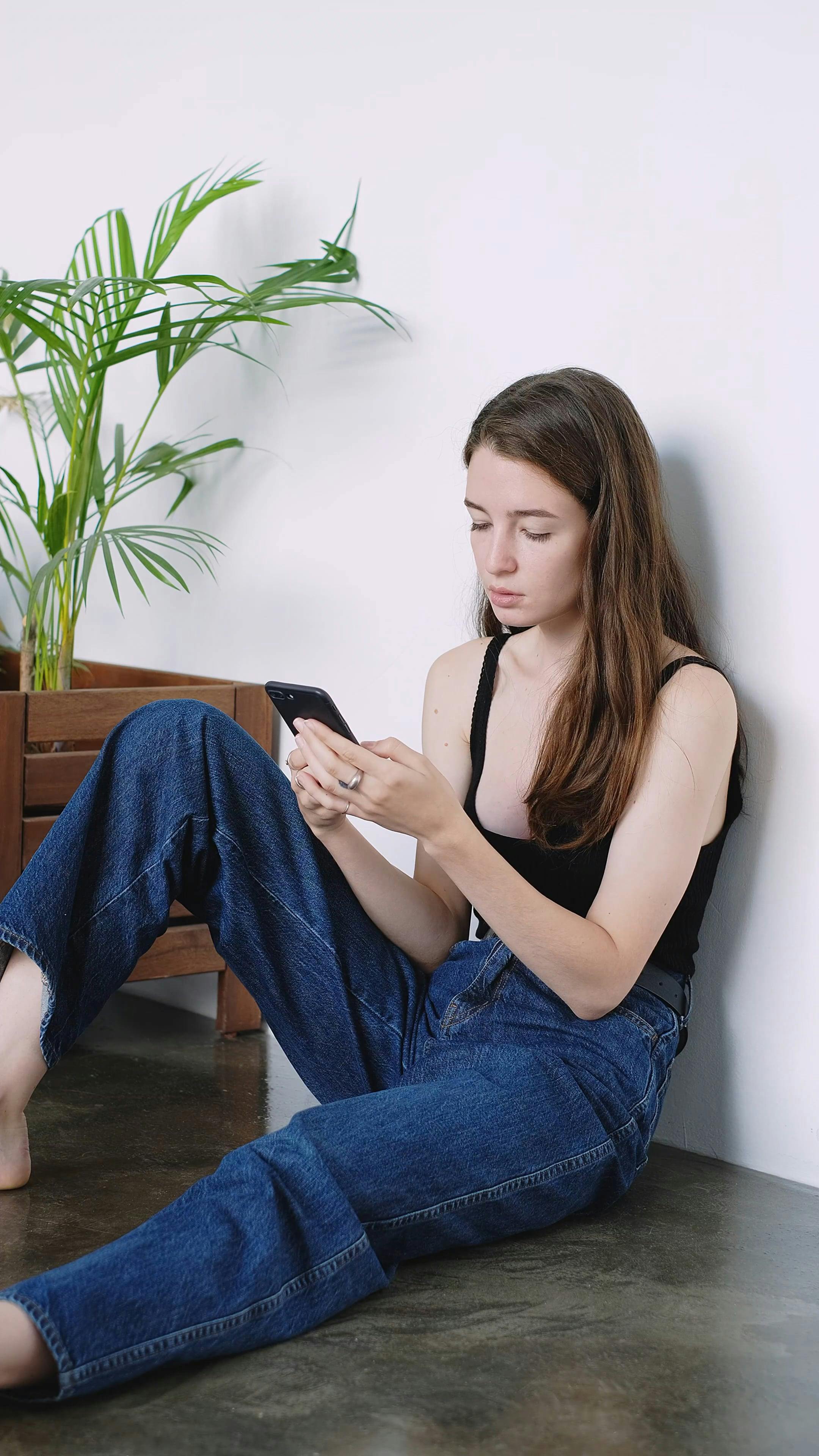 Bored Woman Browsing On The Phone · Free Stock Video