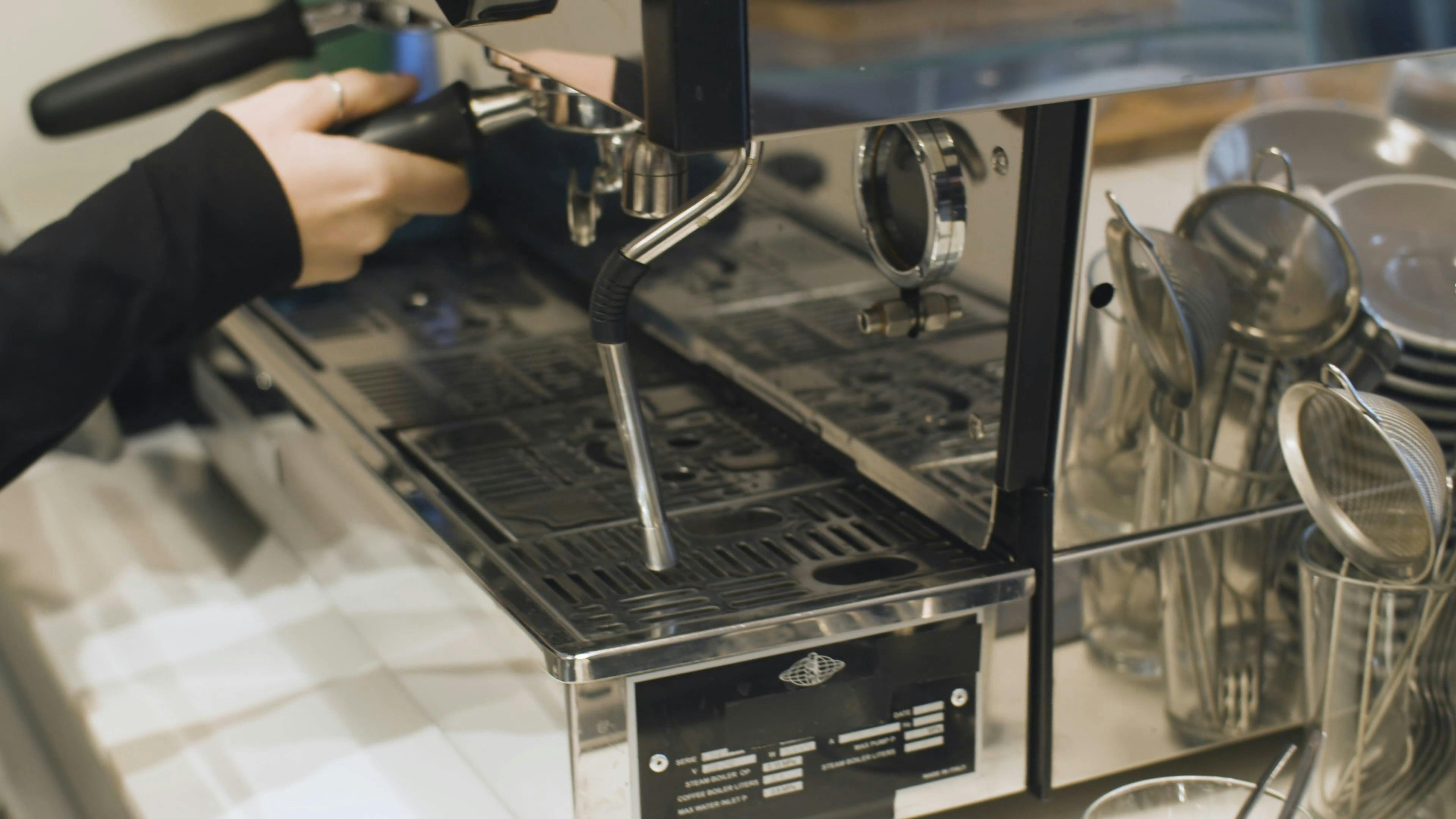 A Person Wiping Coffee Maker with a Cloth Free Stock Video Footage ...