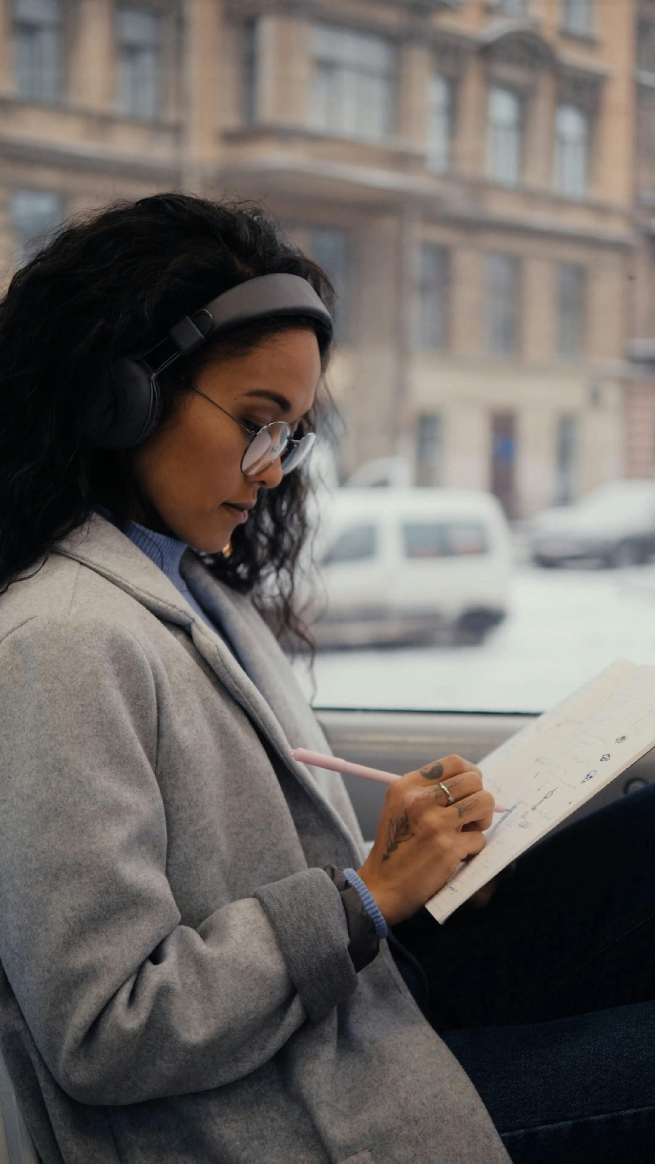 A Woman Writing while Listening to Music Free Stock Video Footage ...
