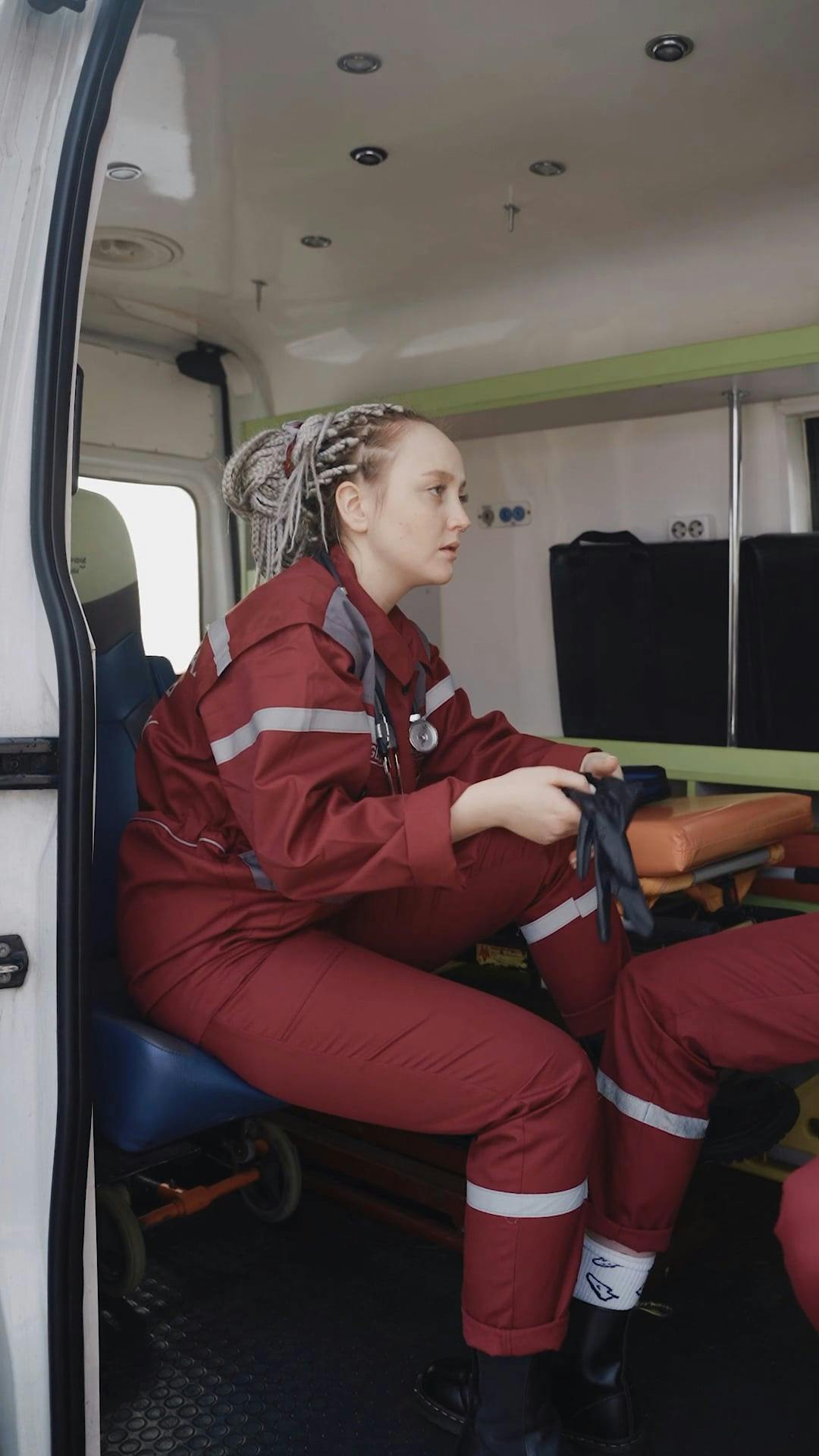 An Ambulance Parked On A Street With Emergency Flashers On Free Stock ...