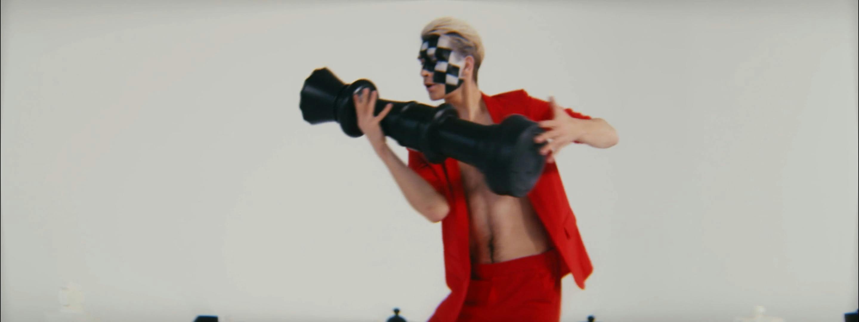 Male Model Dancing and Posing with Chess Piece · Free Stock Video