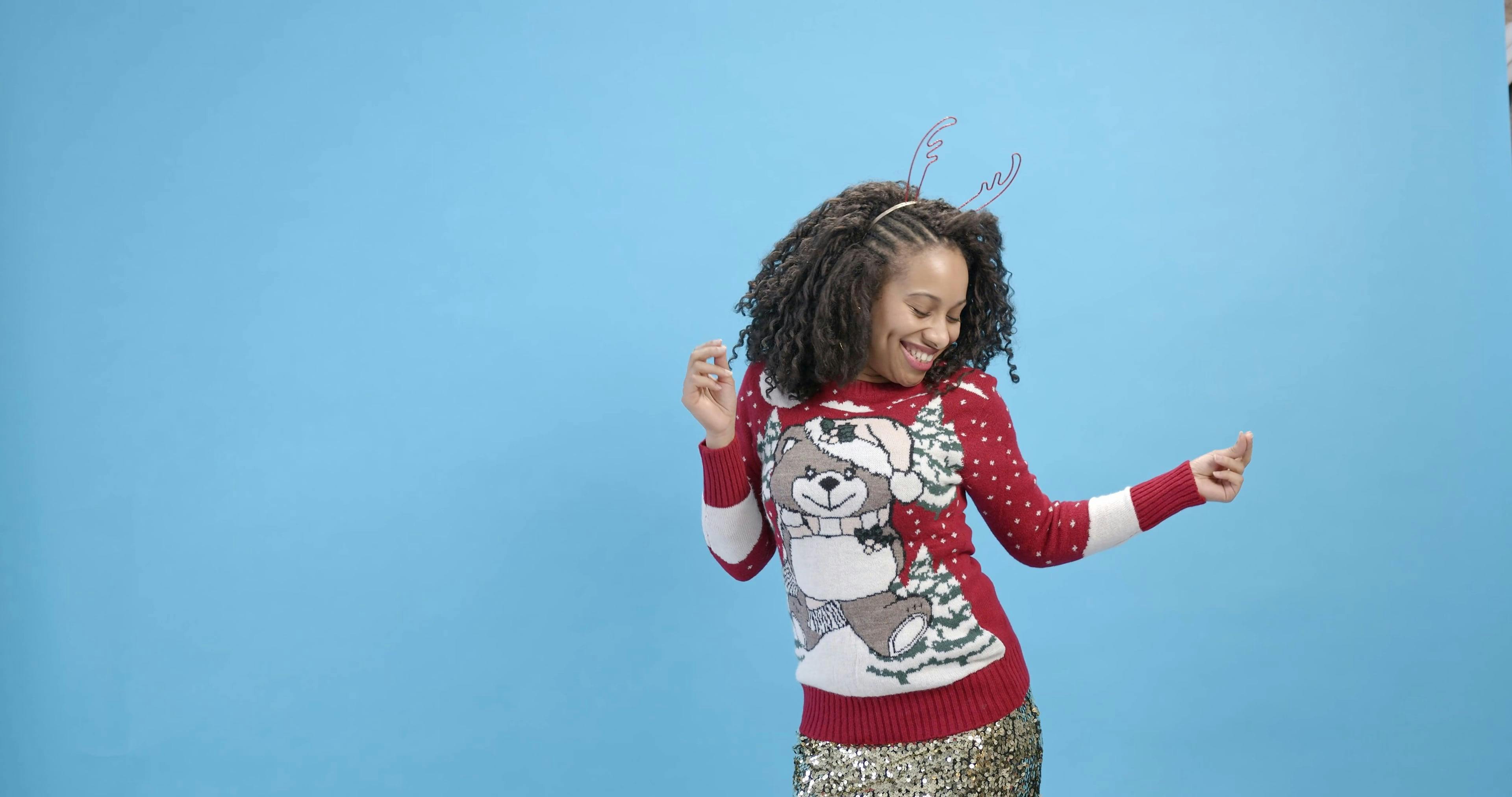 Woman Wearing Christmas Sweater Dancing · Free Stock Video