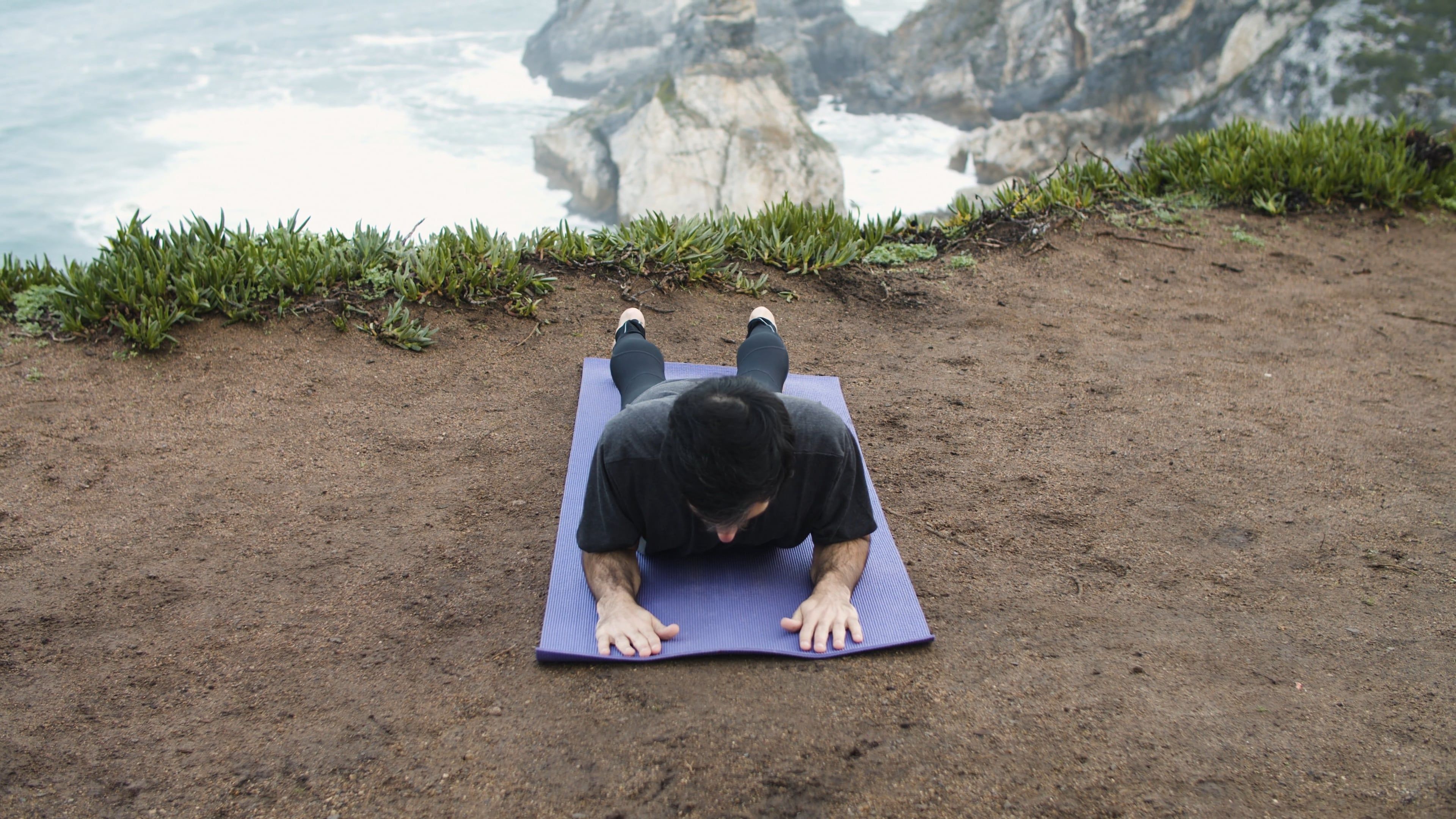 Woman Stretching Near A Cliff · Free Stock Video