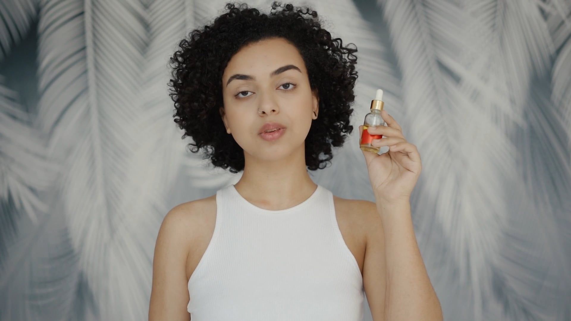 A Woman Holding A Bottle Of Essential Oil · Free Stock Video