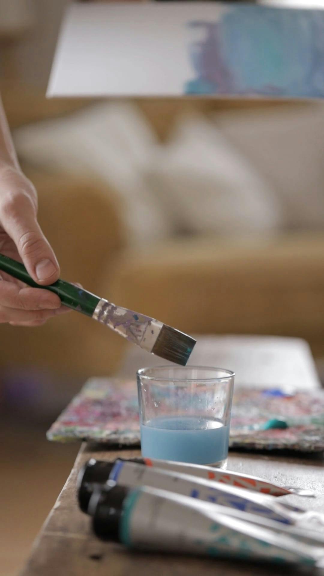 Close up Shot of a Paintbrush Being Dipped in Water Free Stock Video ...