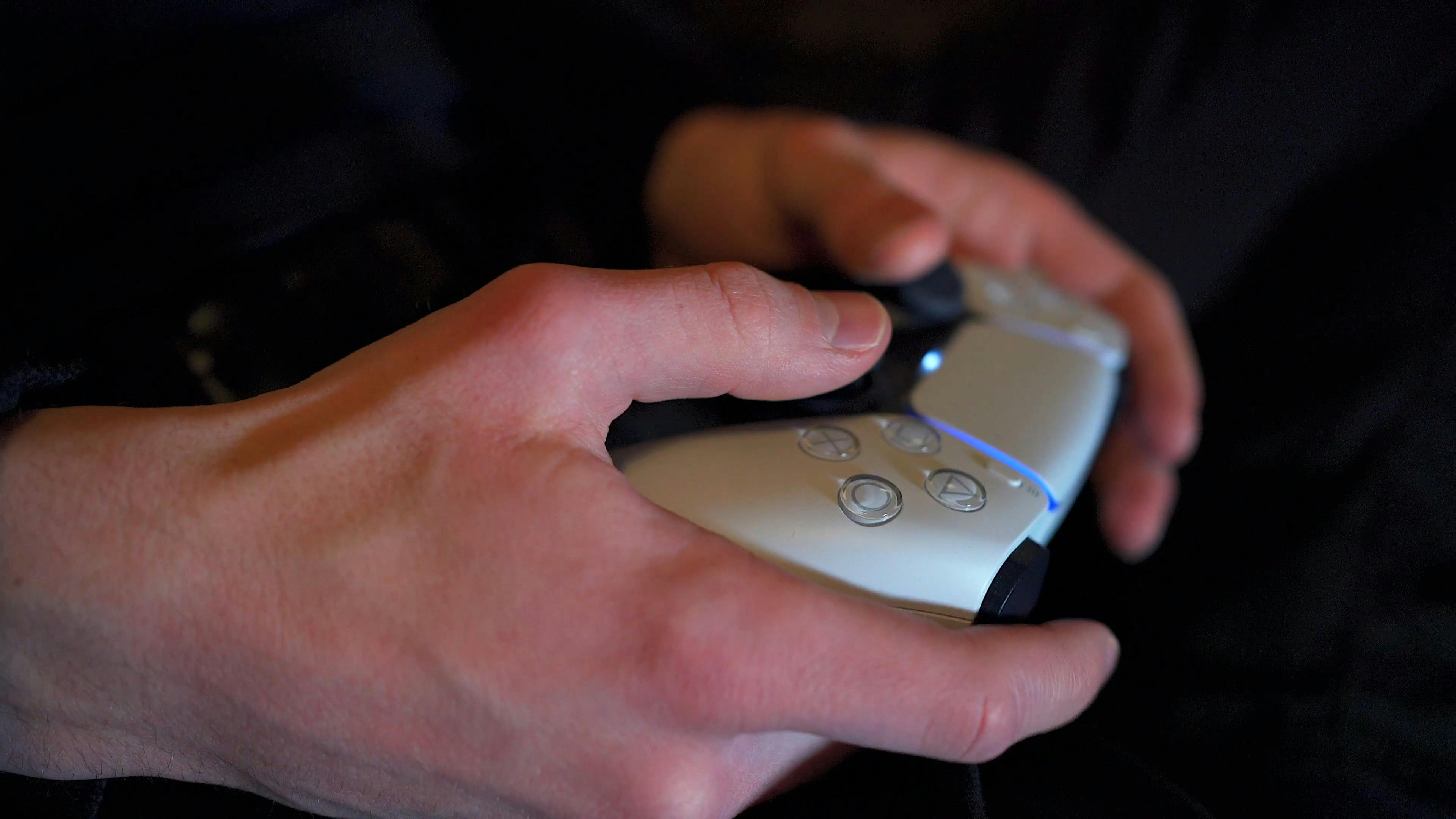 A Person Holding a Wireless Game Controller · Free Stock Video