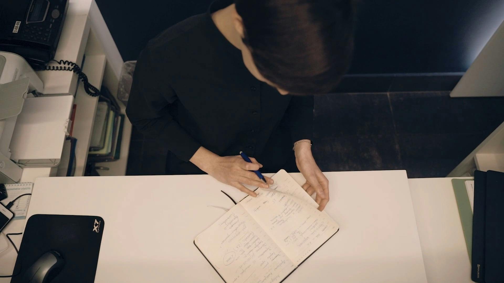 A Person Flipping Pages of a Notebook · Free Stock Video