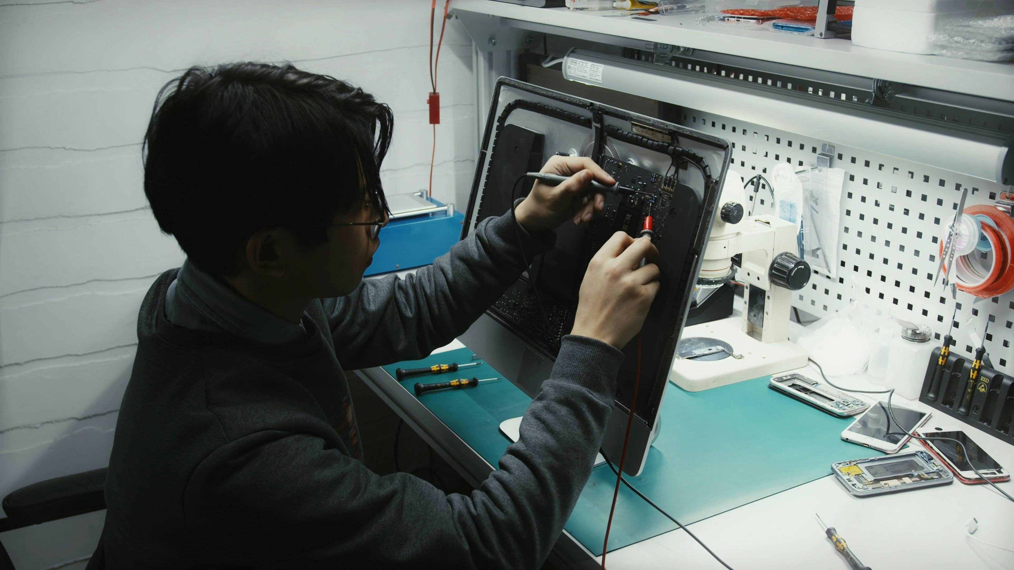 A Man Fixing Electronic Gadgets Free Stock Video Footage, Royalty-Free ...