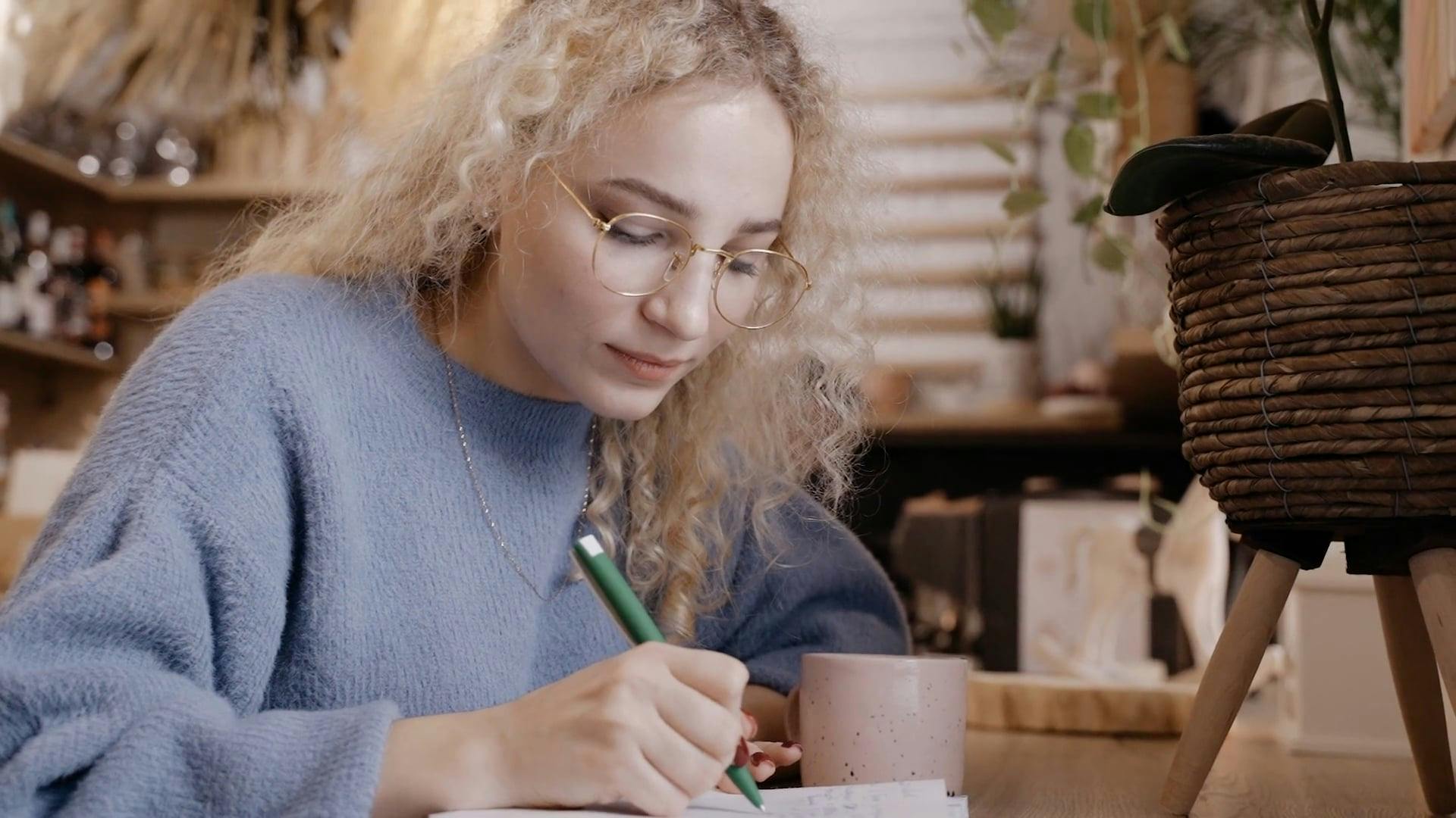 A Woman Writing on Her Notebook Free Stock Video Footage, Royalty-Free ...