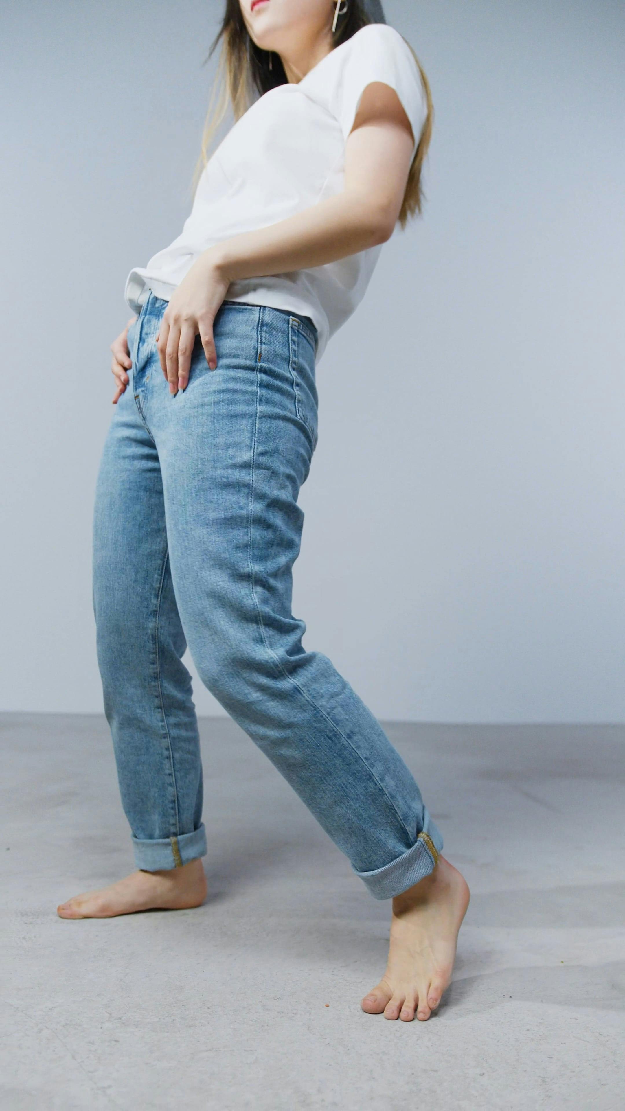 Woman Bending Wearing a White Shirt and Jeans Free Stock Video Footage ...