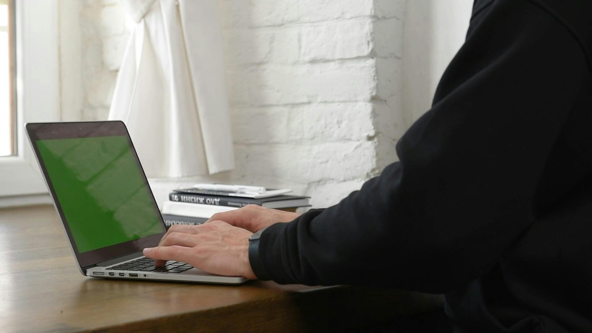 Man Typing on His Laptop While Sitting · Free Stock Video