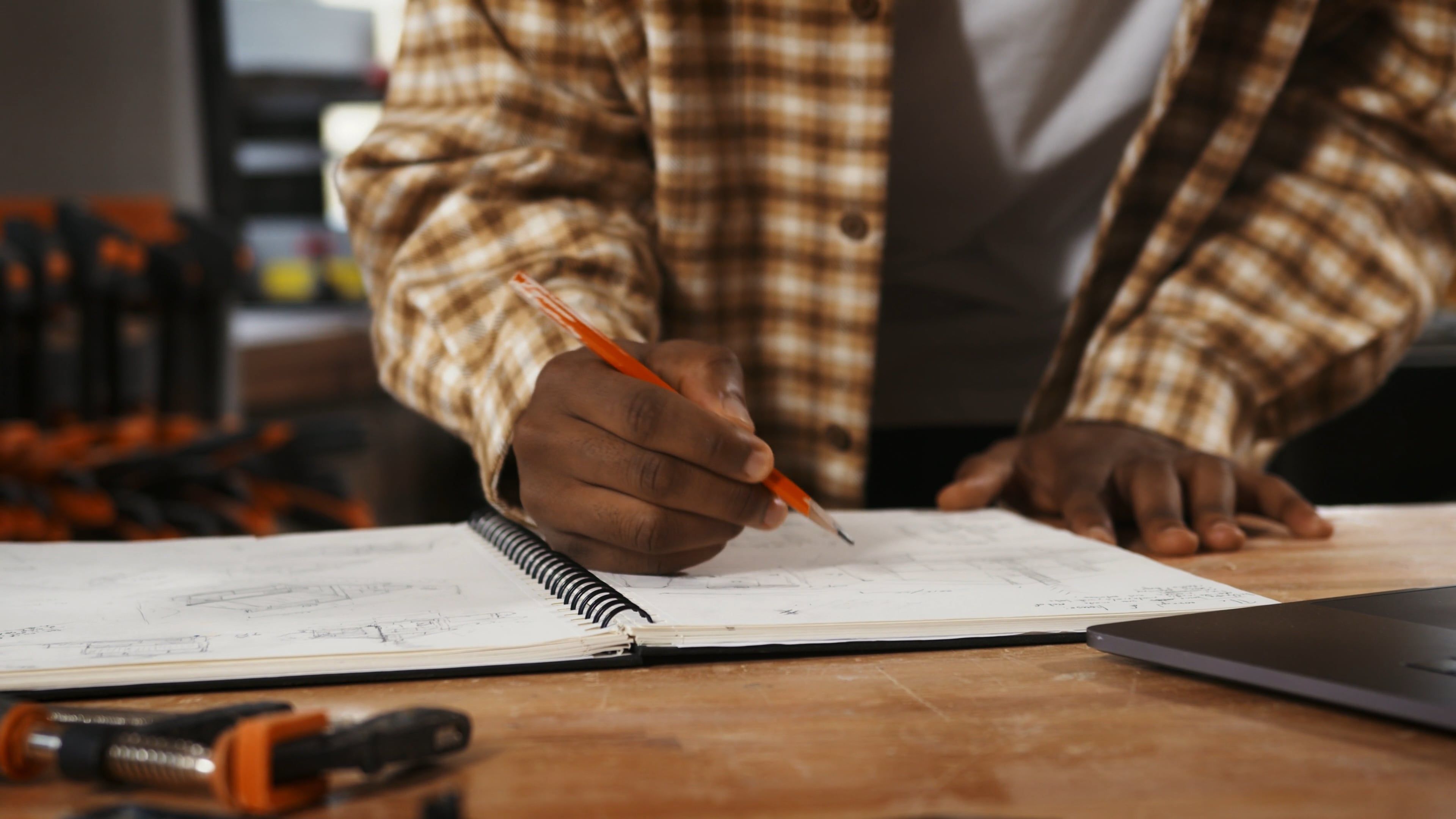 Close Up Shot of a Man Drawing in the Notebook · Free Stock Video
