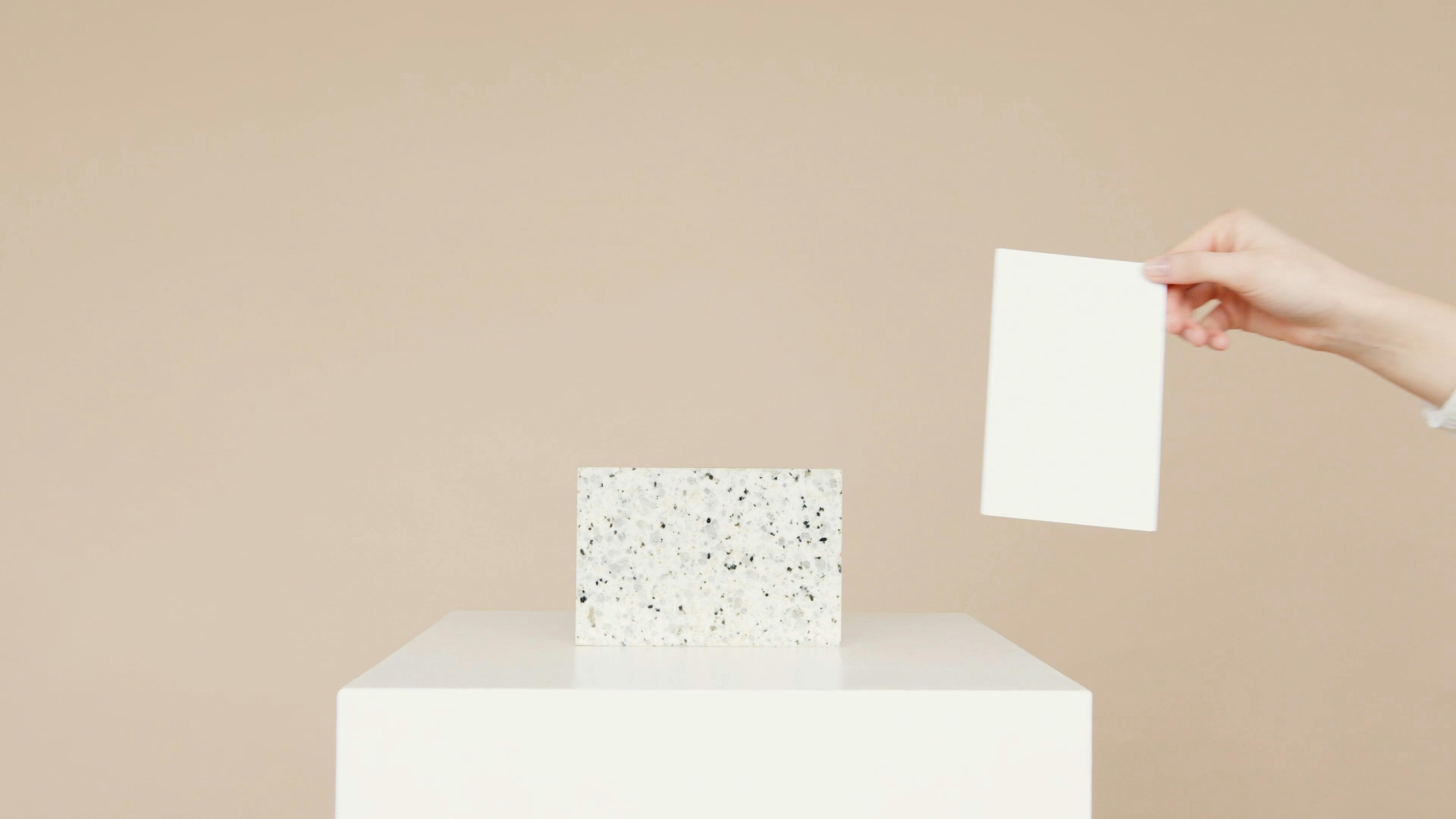 Person Placing Piece of Paper on a Table · Free Stock Video