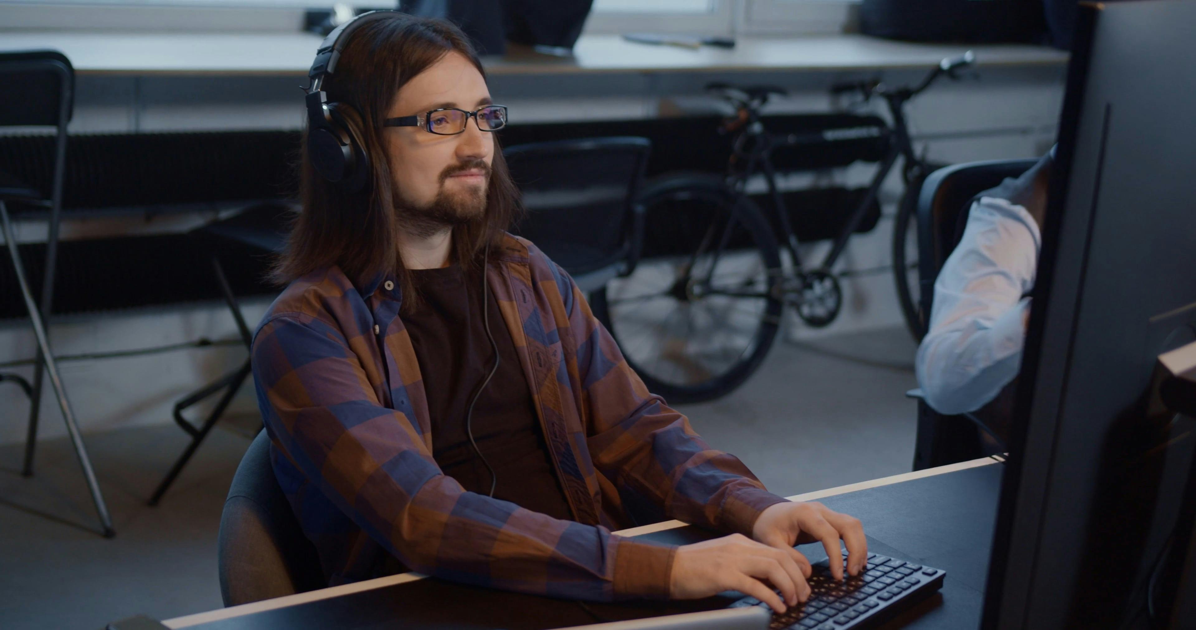 A Man Typing on a Keyboard · Free Stock Video